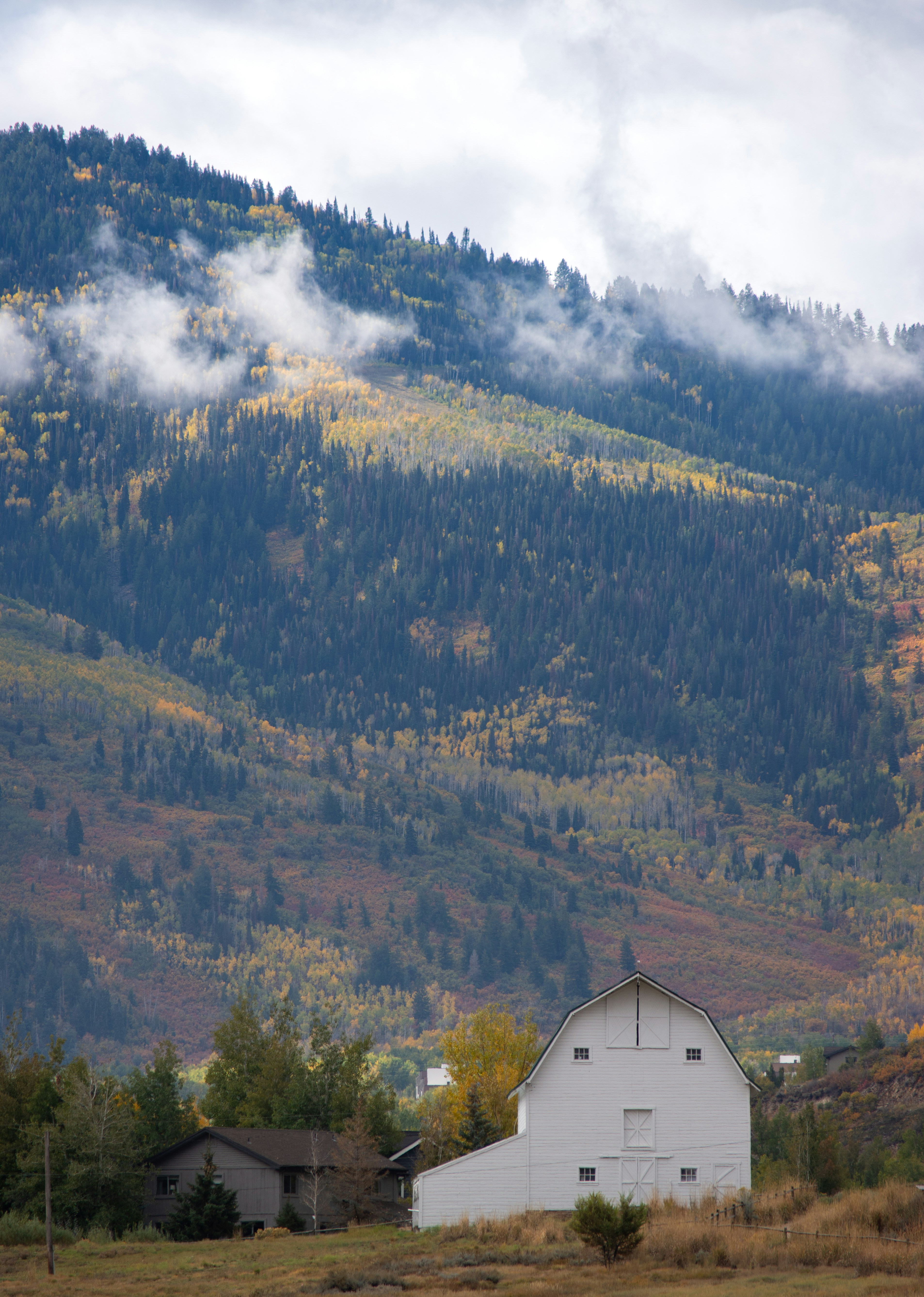 White Barn at the Edge of Autumn-Mist Mountains
