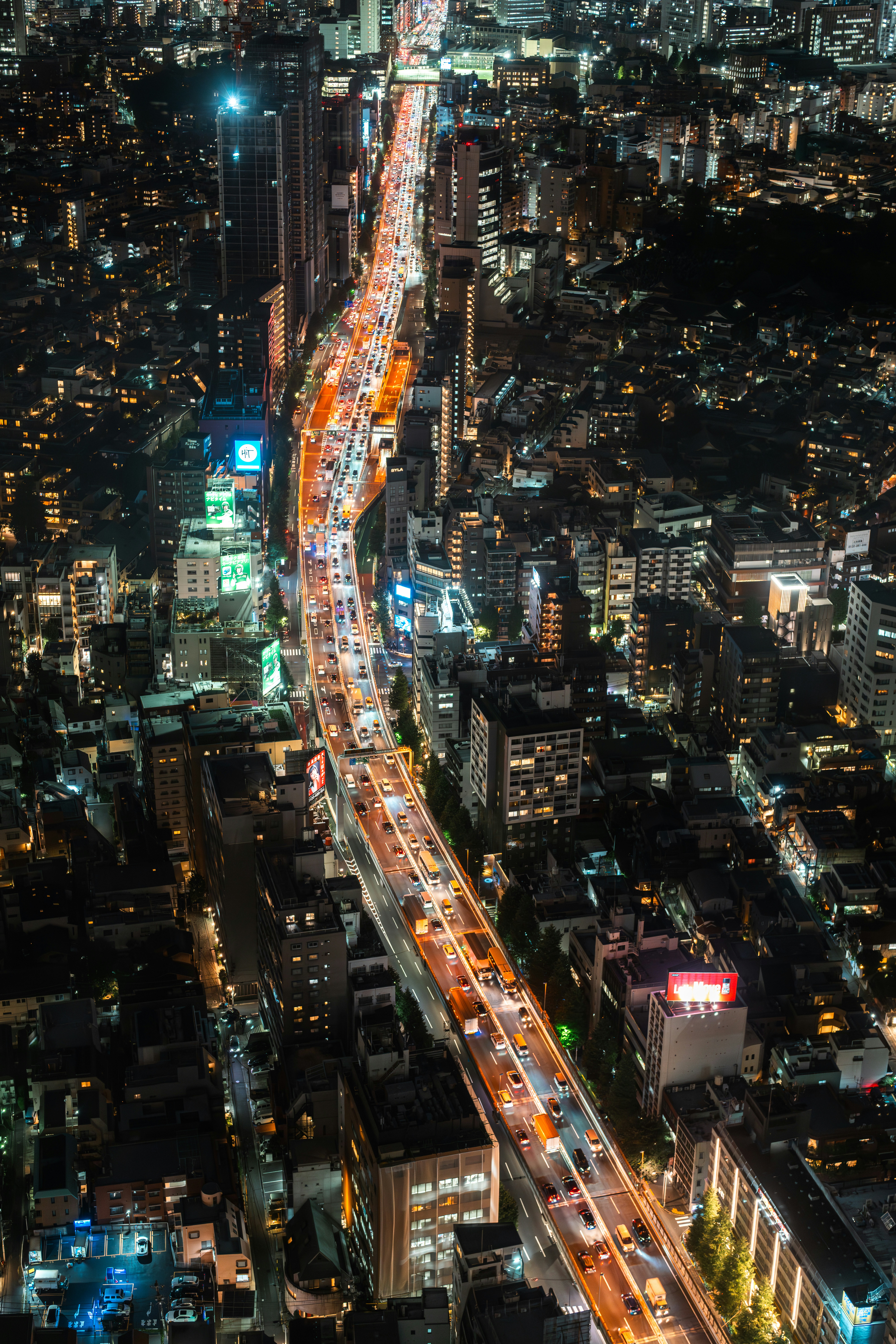 An aerial view of a busy city at night photo – Free Tokyo Image on Unsplash
