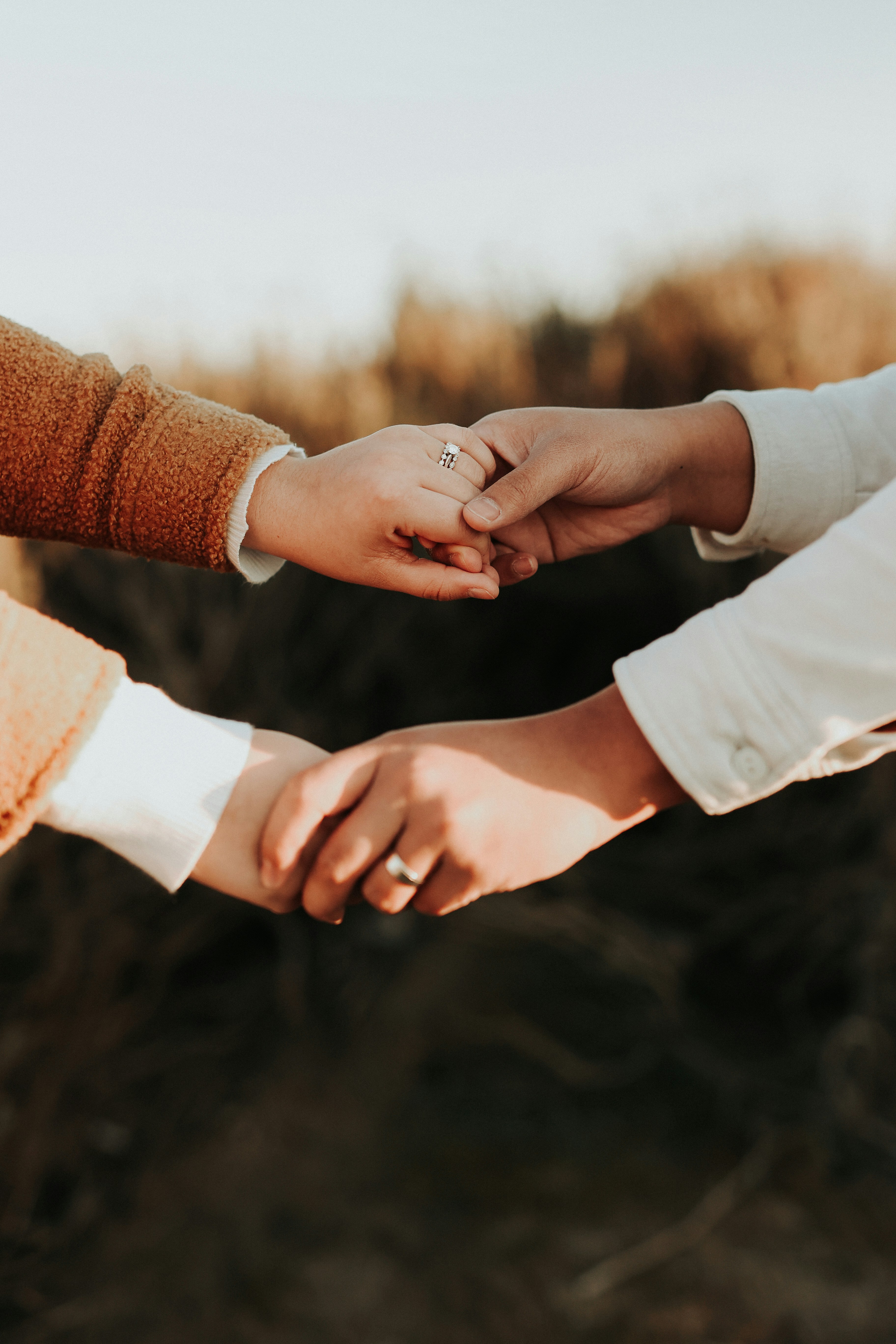 A close up of two people holding hands photo – Free Husband and wife ...
