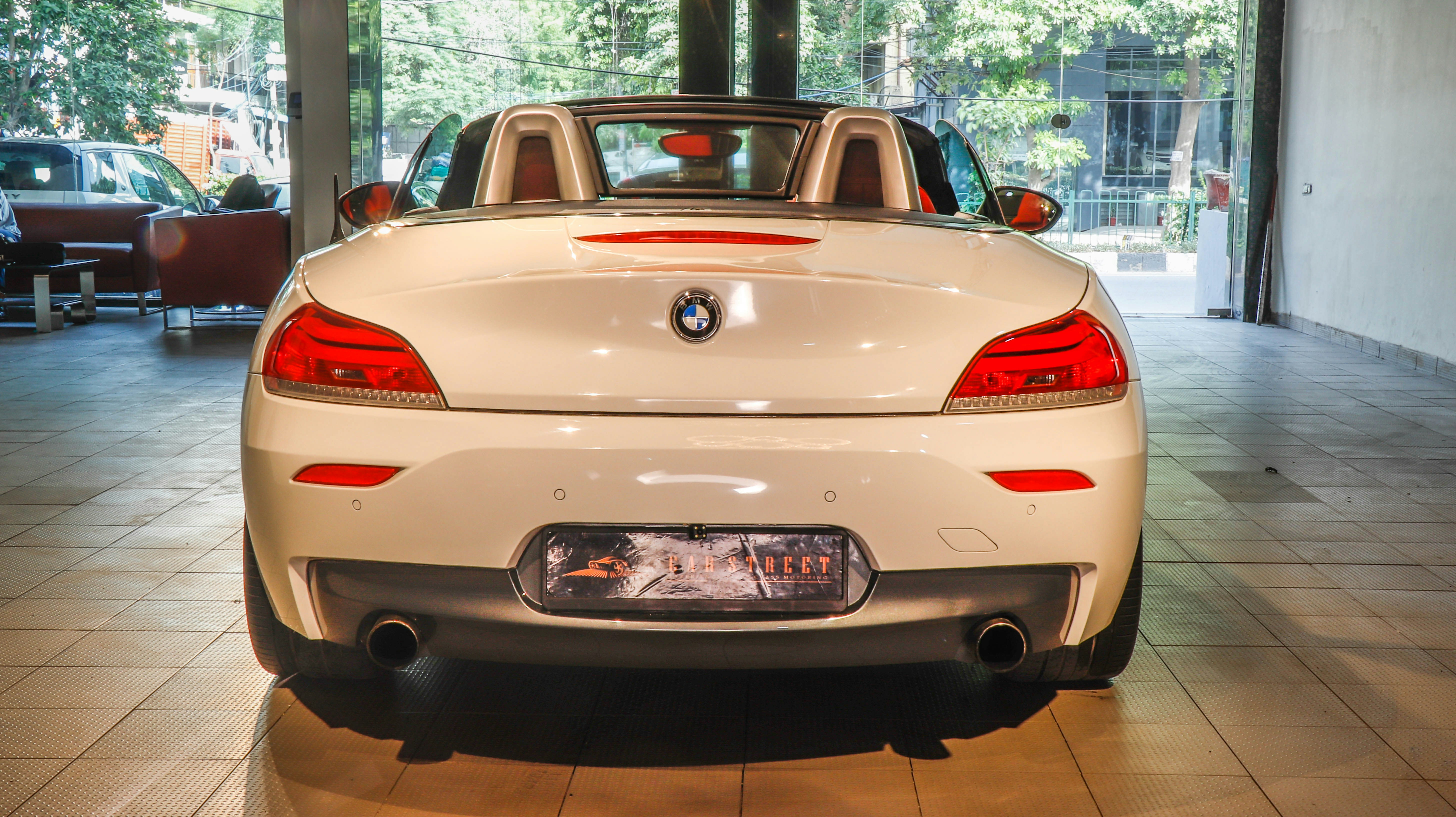 A white car parked inside of a building photo – Free Vehicle Image on ...