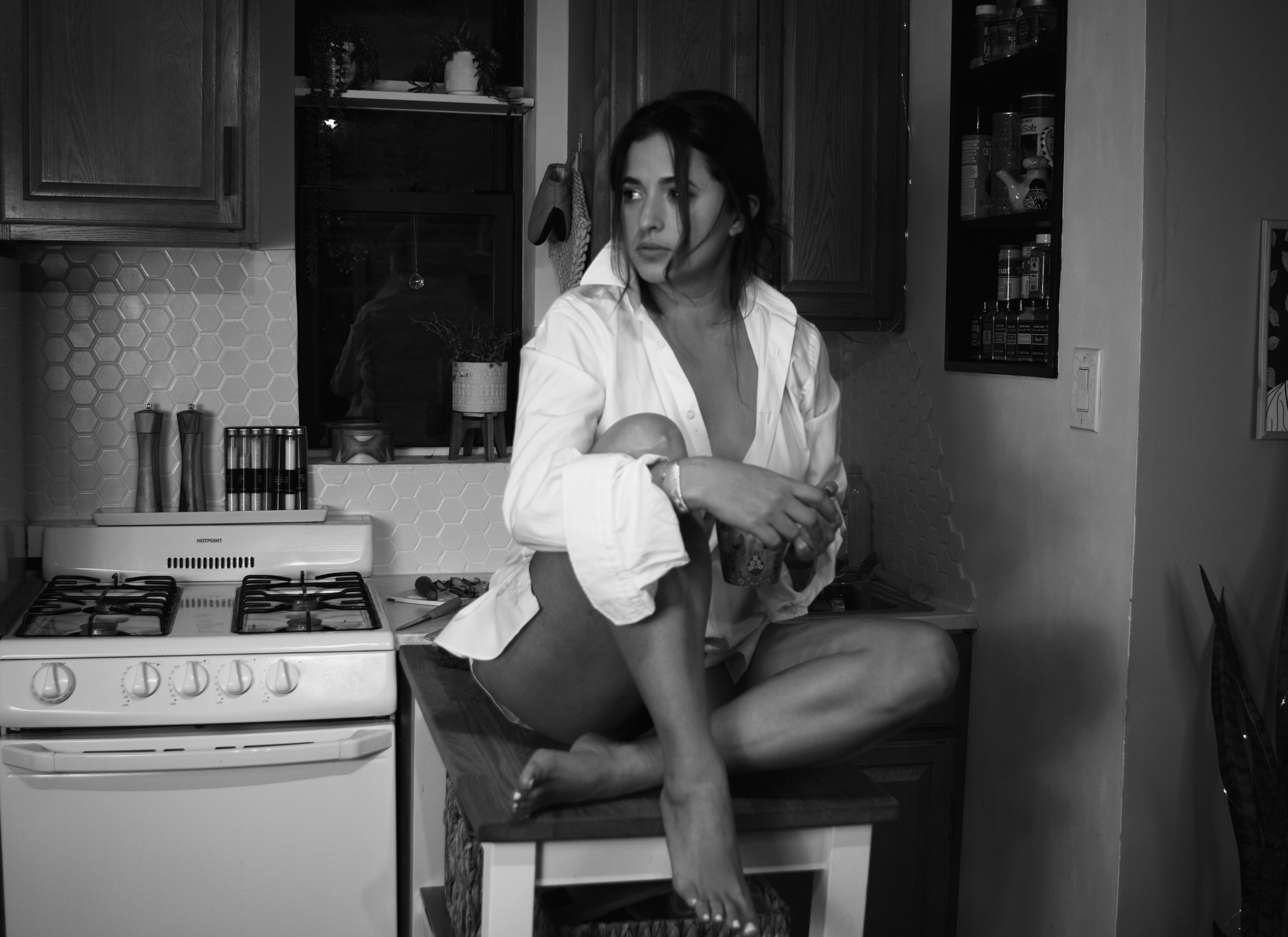 Pensive Portrait on a Kitchen Threshold