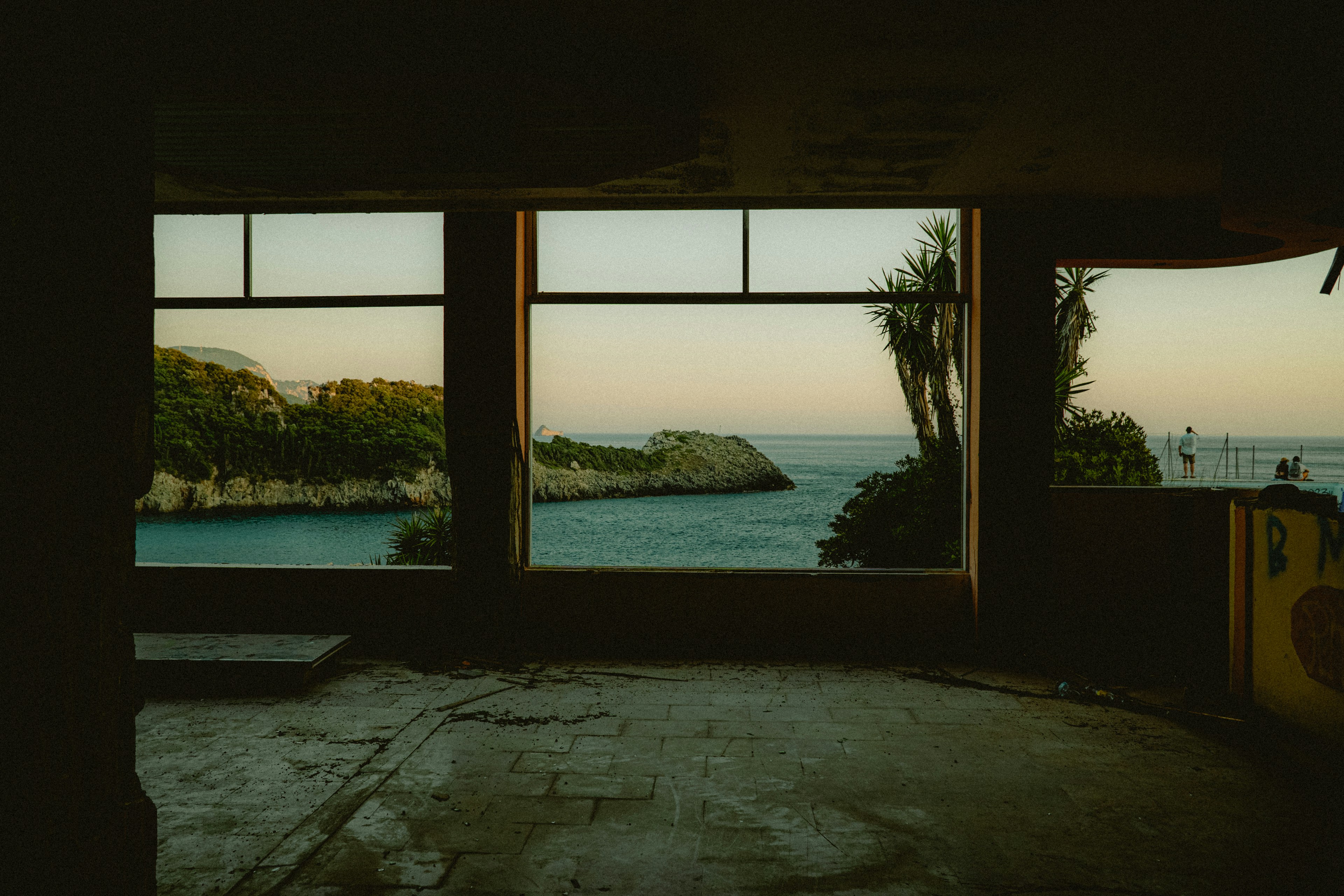 Three-Frame Portal: Quiet Sea Through an Abandoned Hall