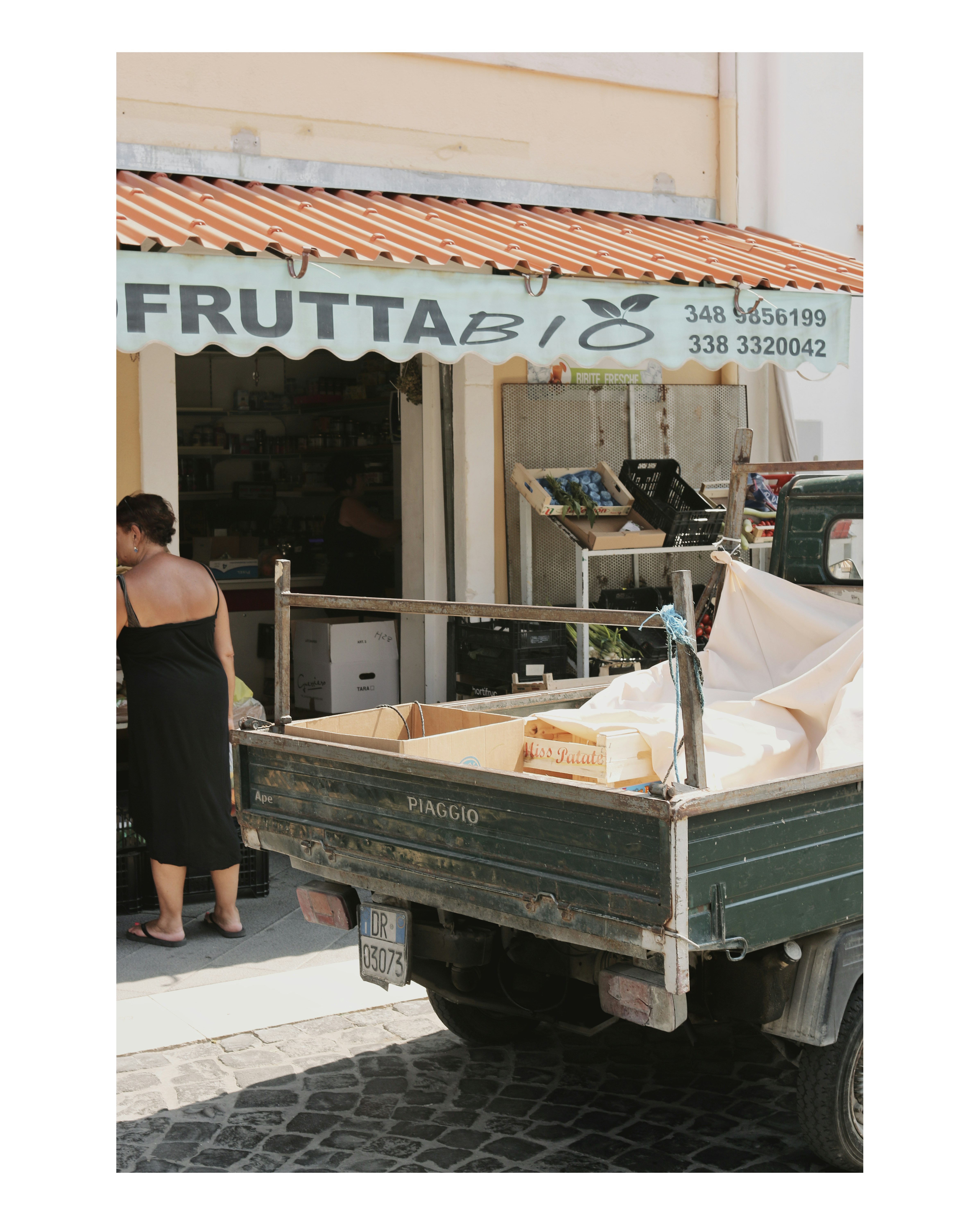 Frutta Shopfront on Cobbled Street with a Green Piaggio Pickup