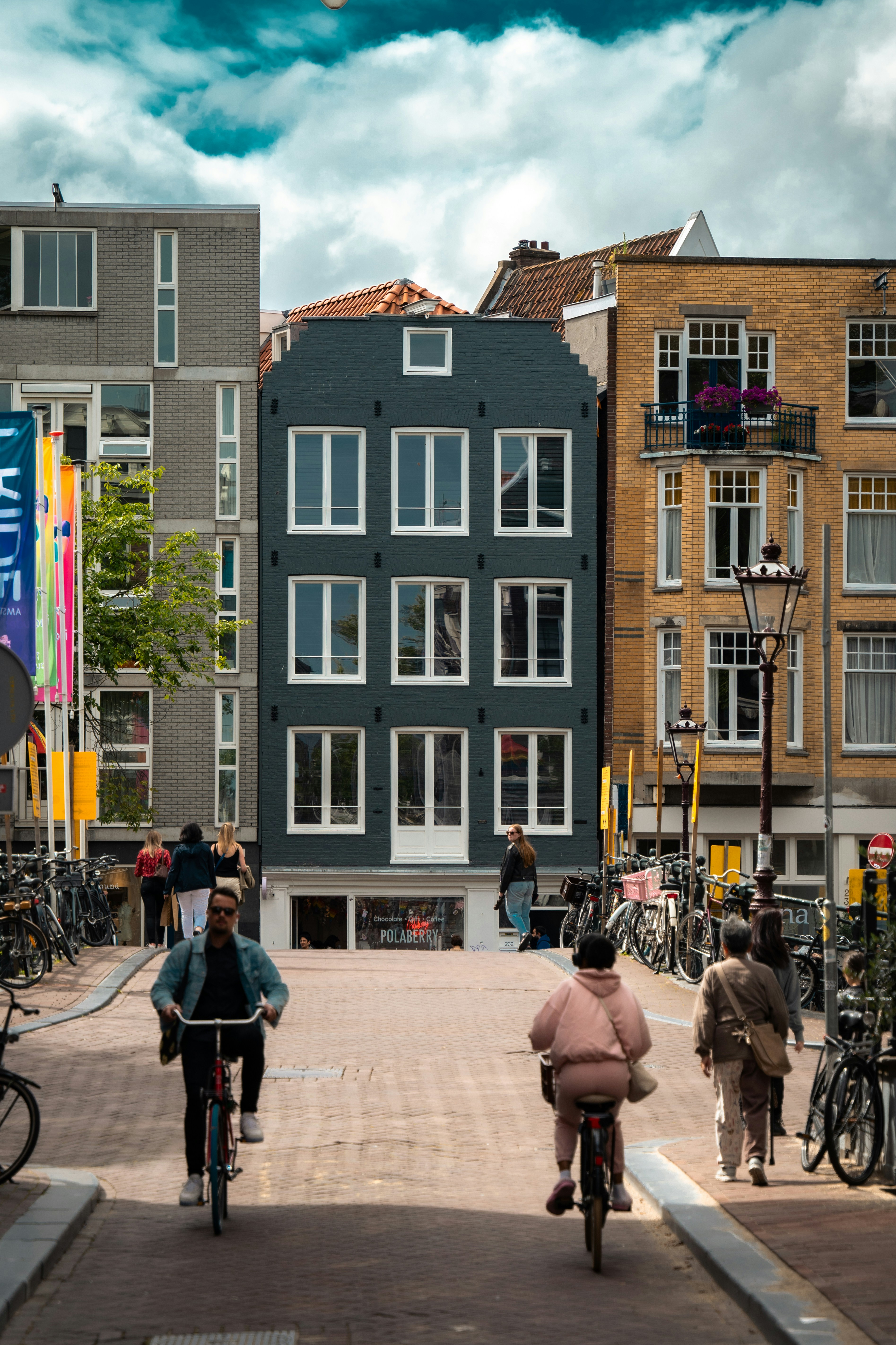 Blue Facade at the Heart: Pedals, Windows, and Dutch Light on a Narrow Street