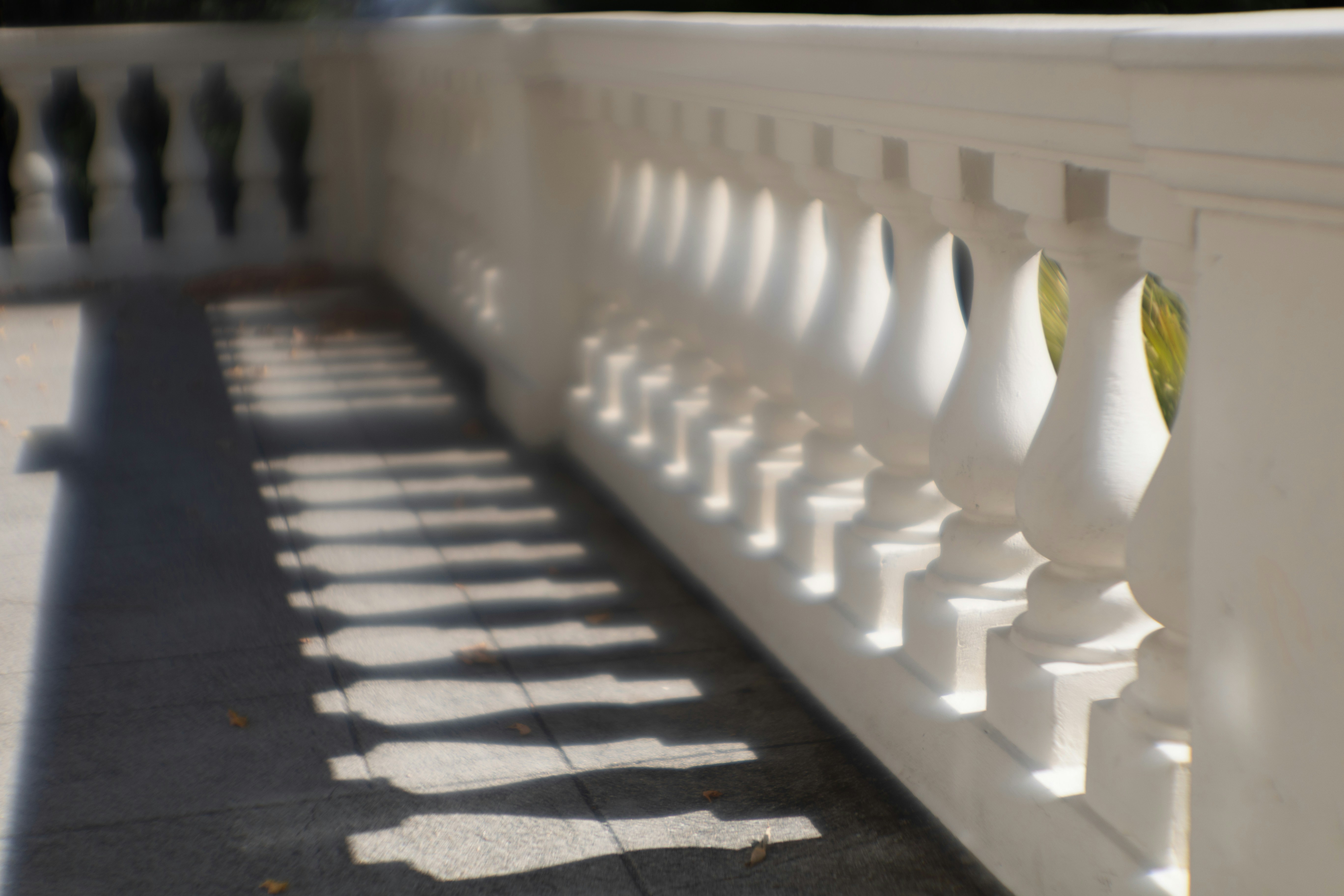 Sunlit Echoes: A Row of Balusters Unfolds into Light
