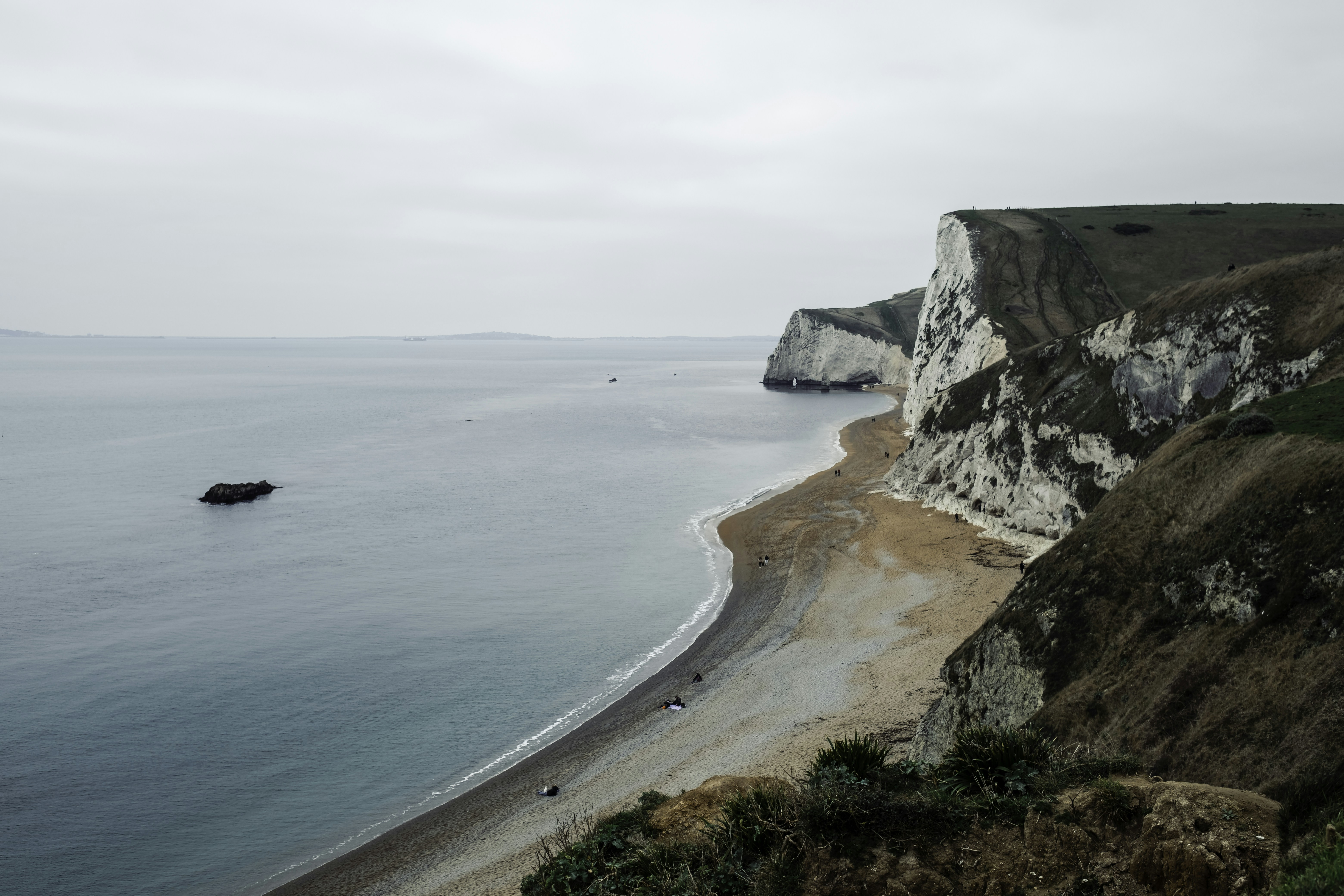 Cliffs Embracing the Serene Shoreline