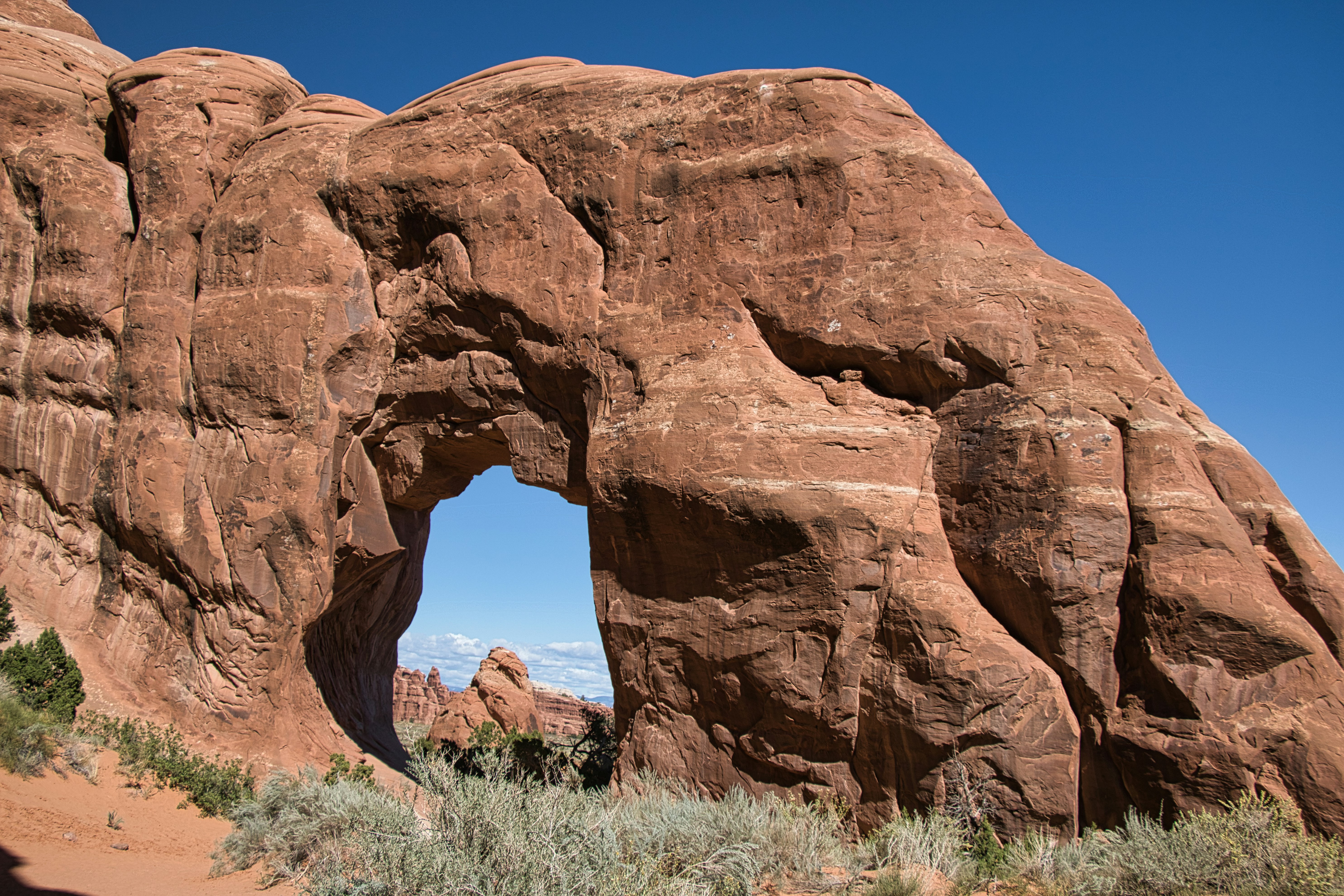A large rock formation with a hole in the middle of it photo – Free Usa ...