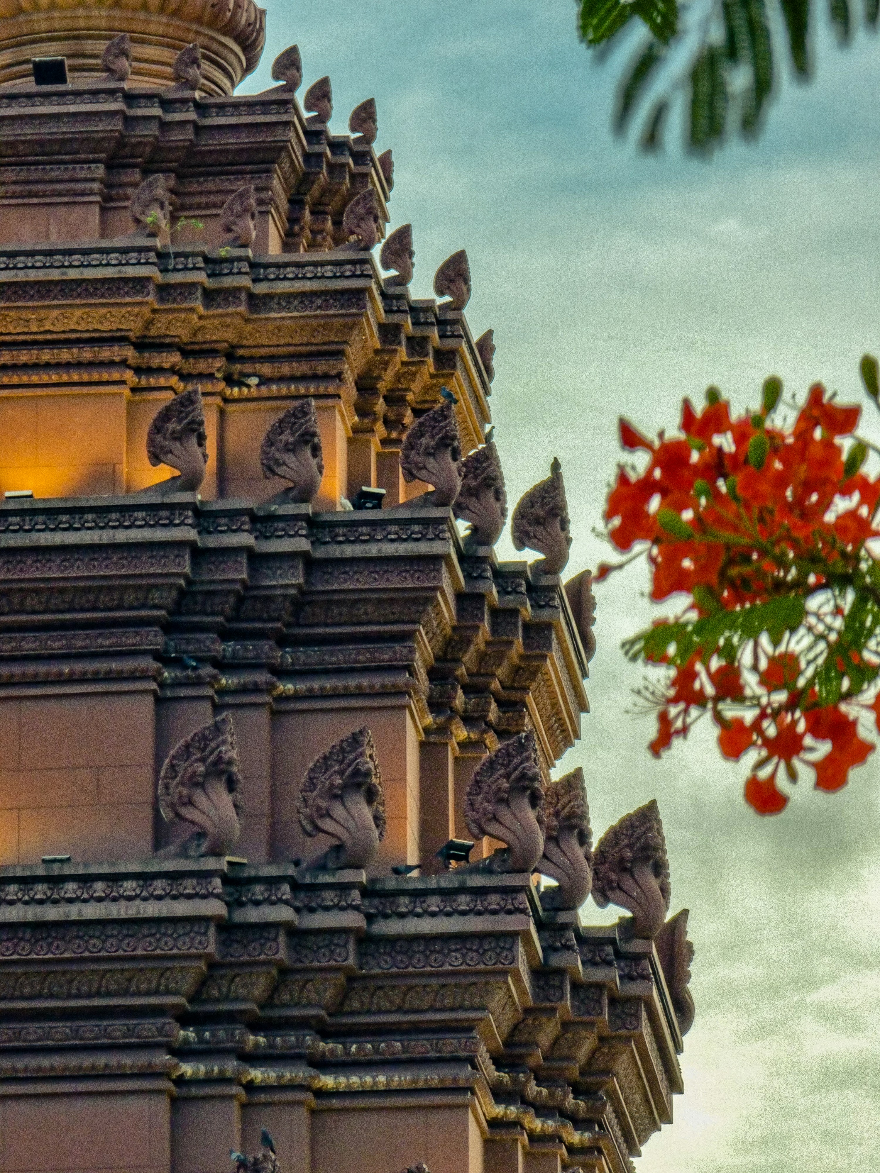 Ornate Temple Spires Reach Toward a Fiery Floral Burst