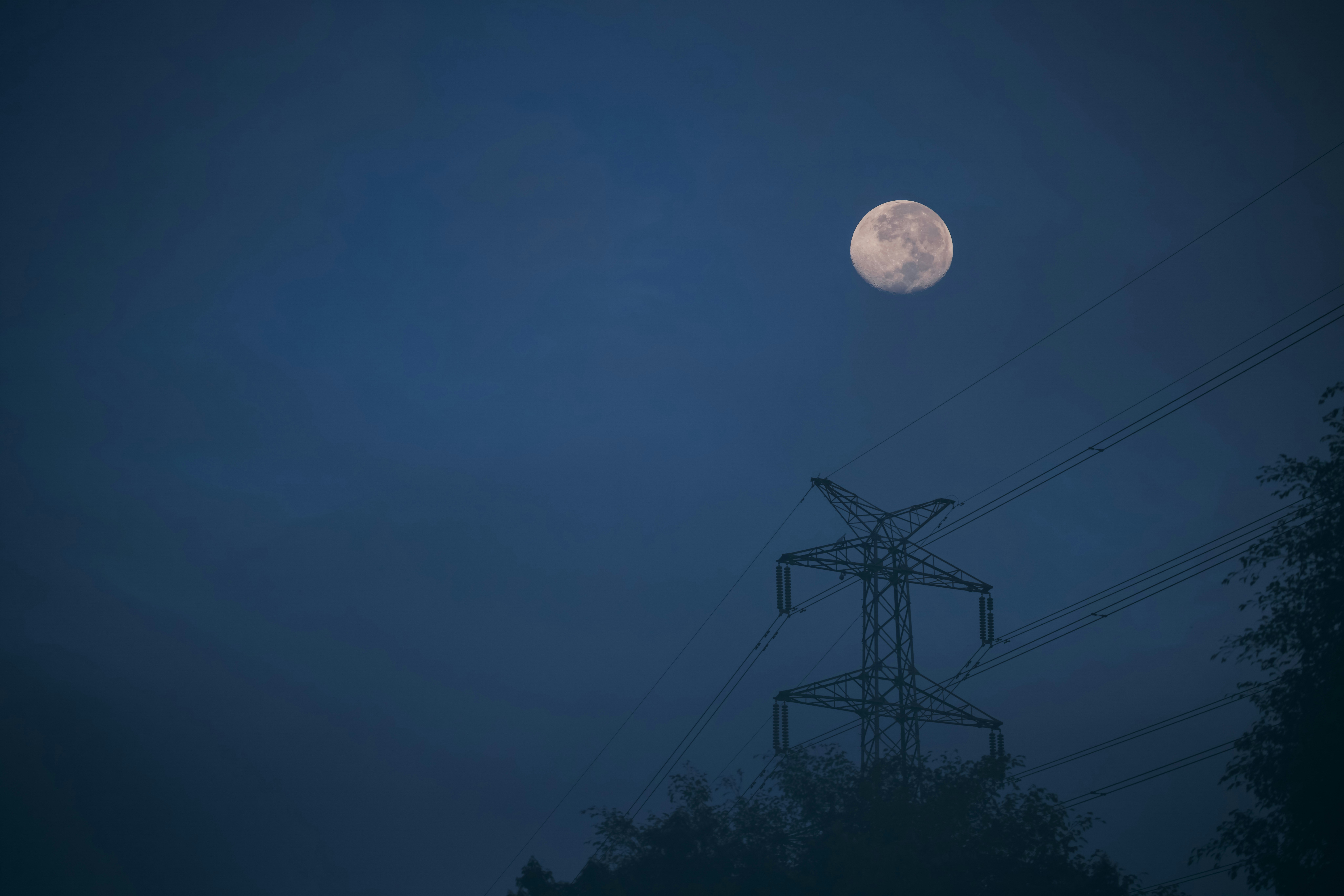 A full moon is seen behind power lines photo – Free Nature Image on ...