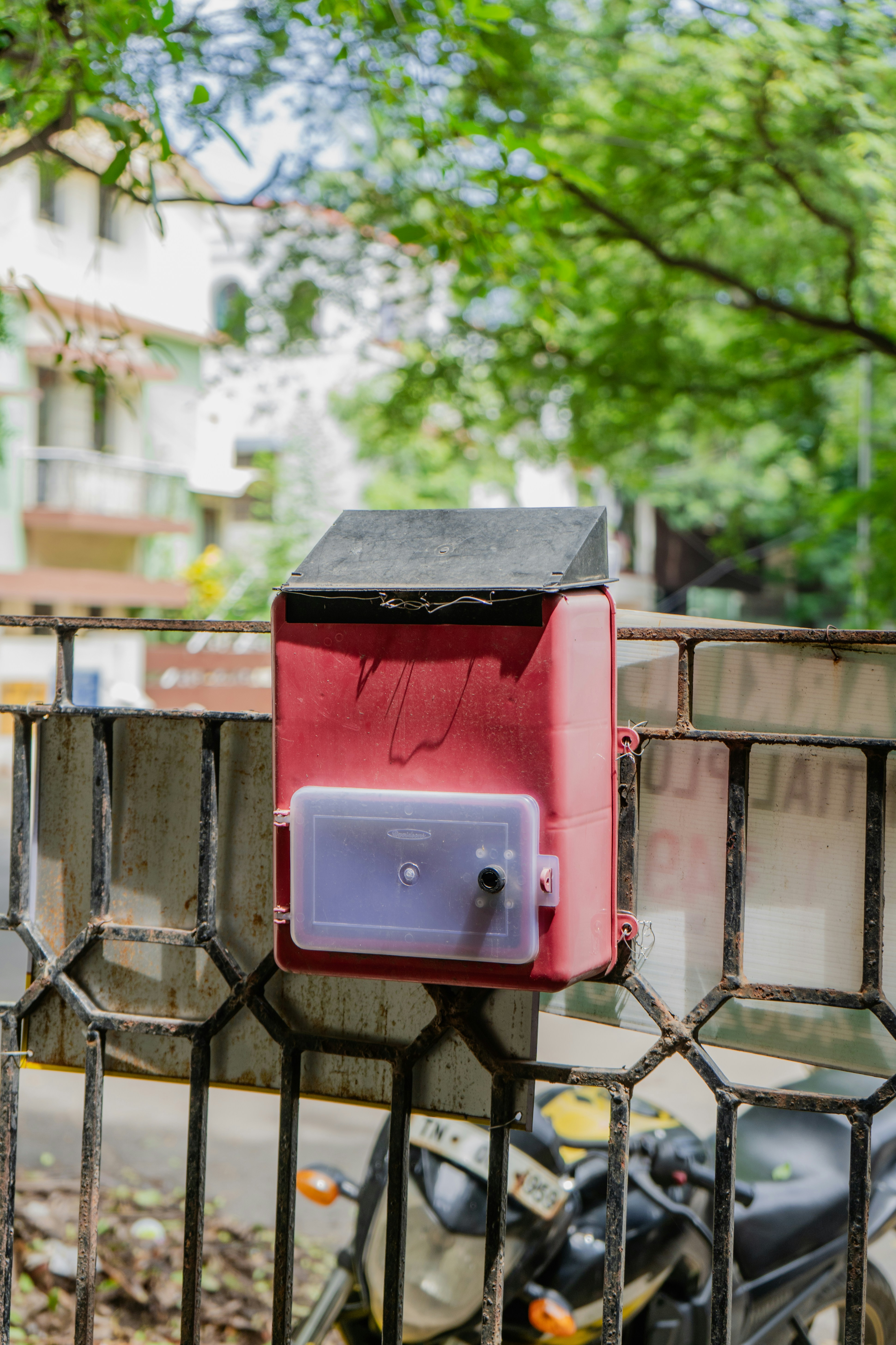 The Unseen Messenger: A Modern Mailbox Amidst Urban Life
