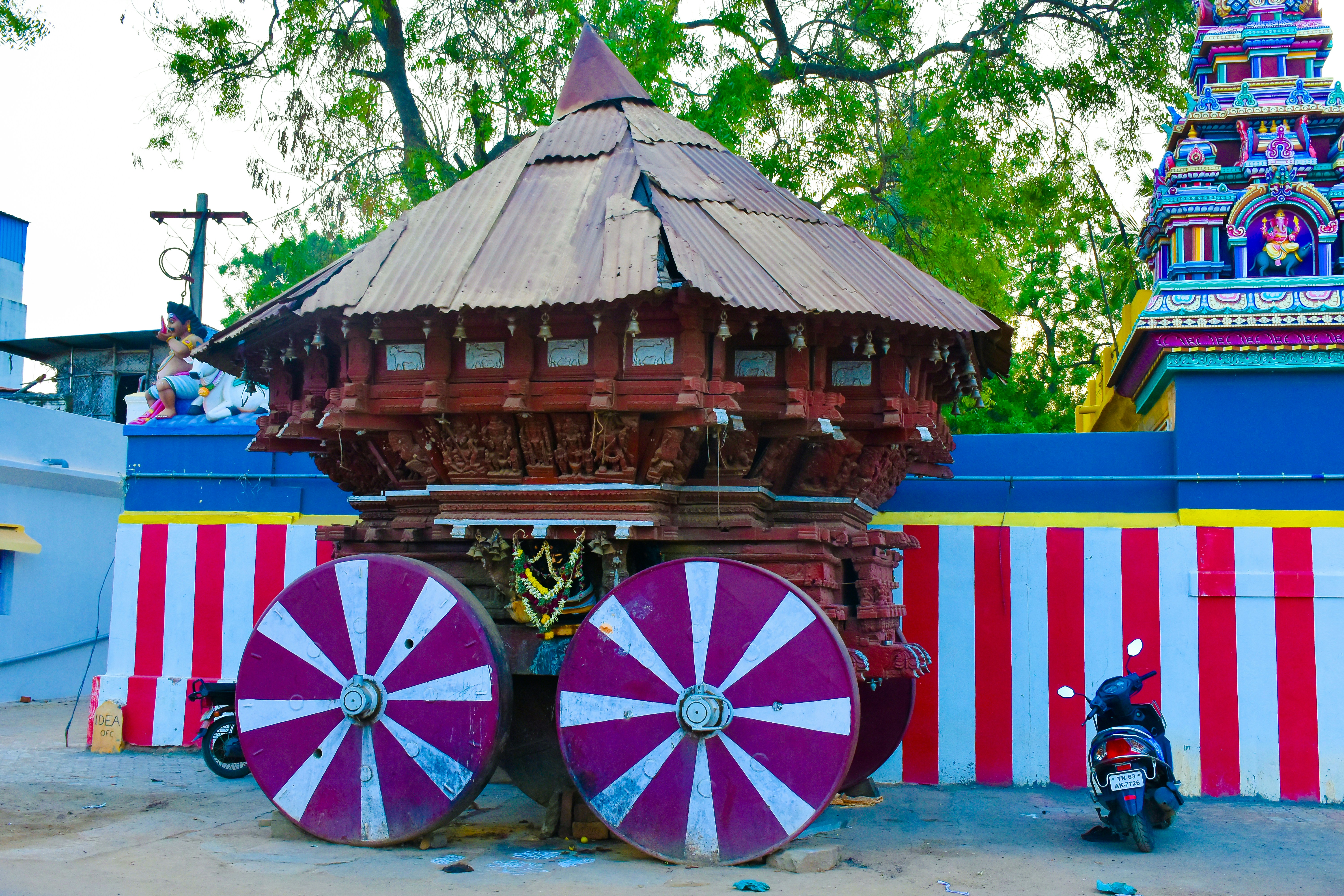 A colorful building with two large wheels in front of it photo – Free ...