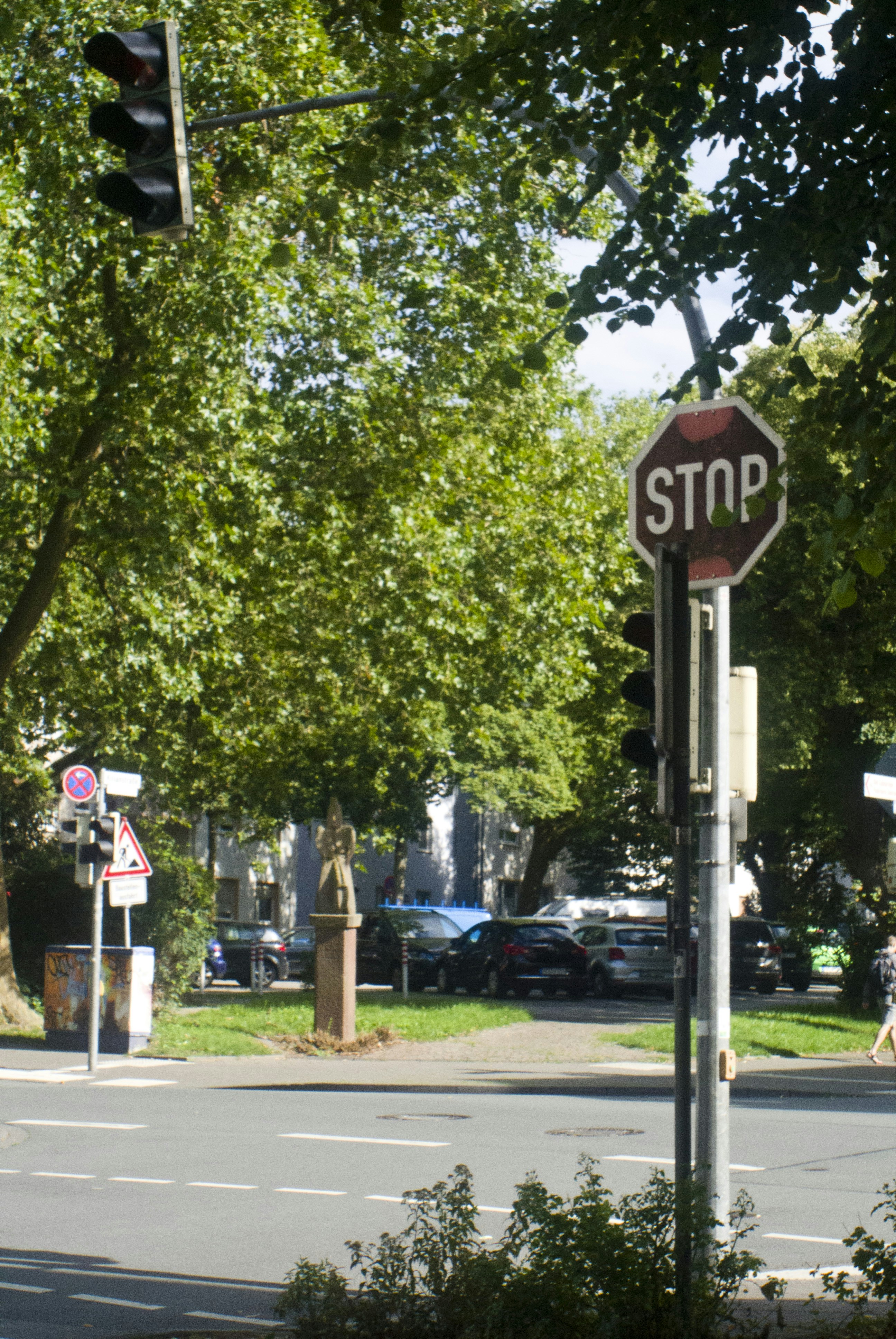 A stop sign at an intersection in a city photo – Free Germany Image on ...