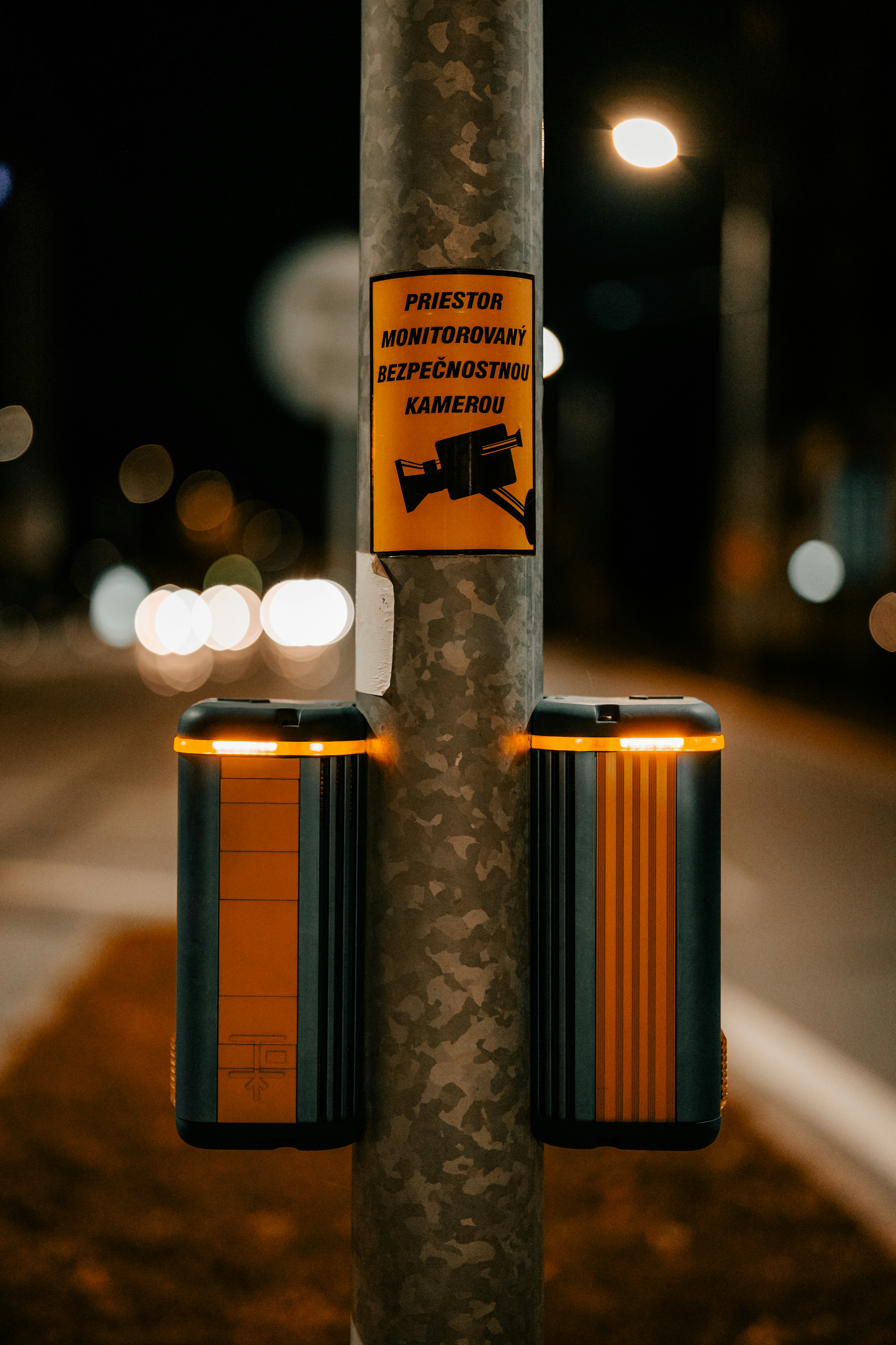 Night Pole Sign: Warm Bokeh on a Quiet Street