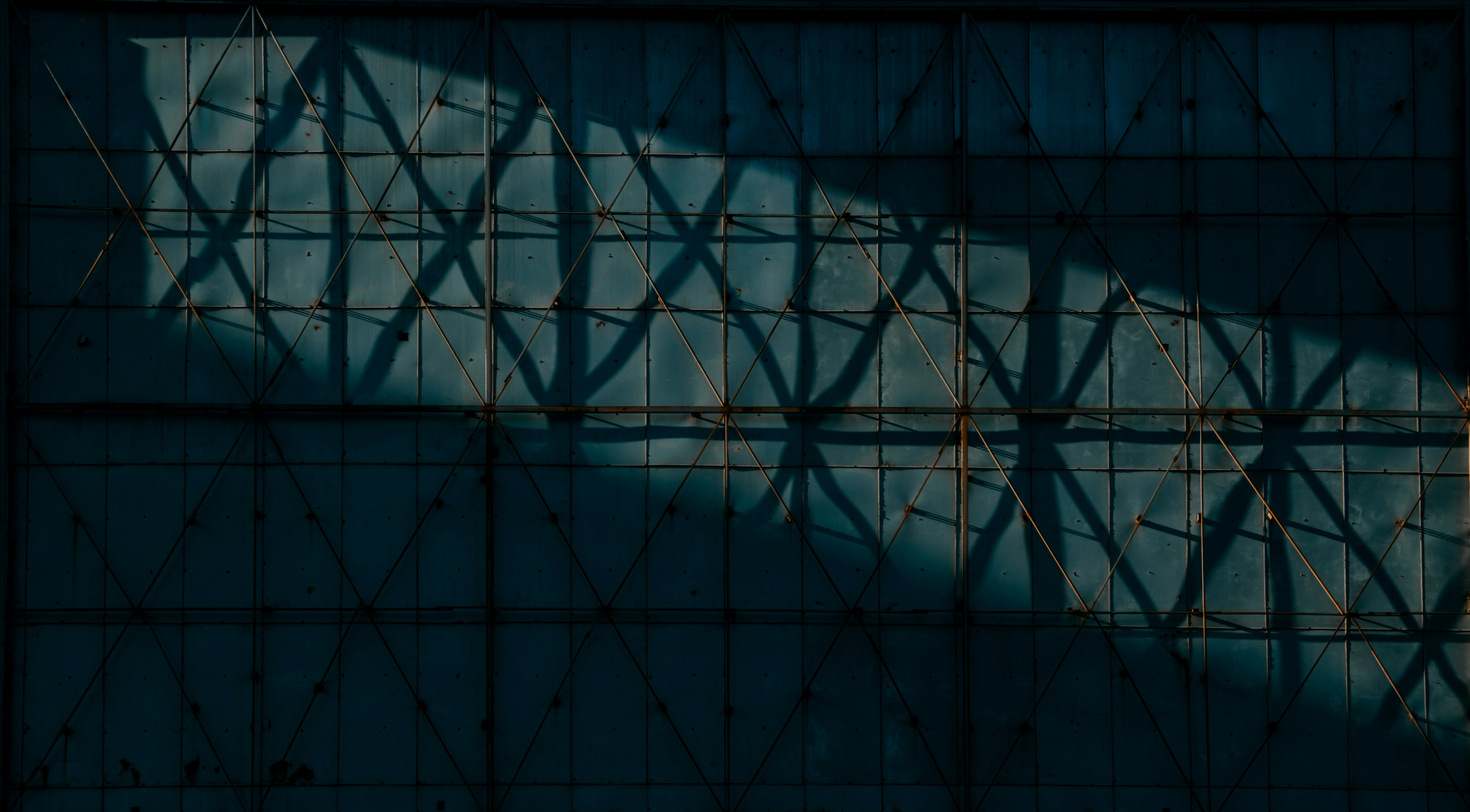 The shadow of a building on a wall photo – Free Gate of the orient ...