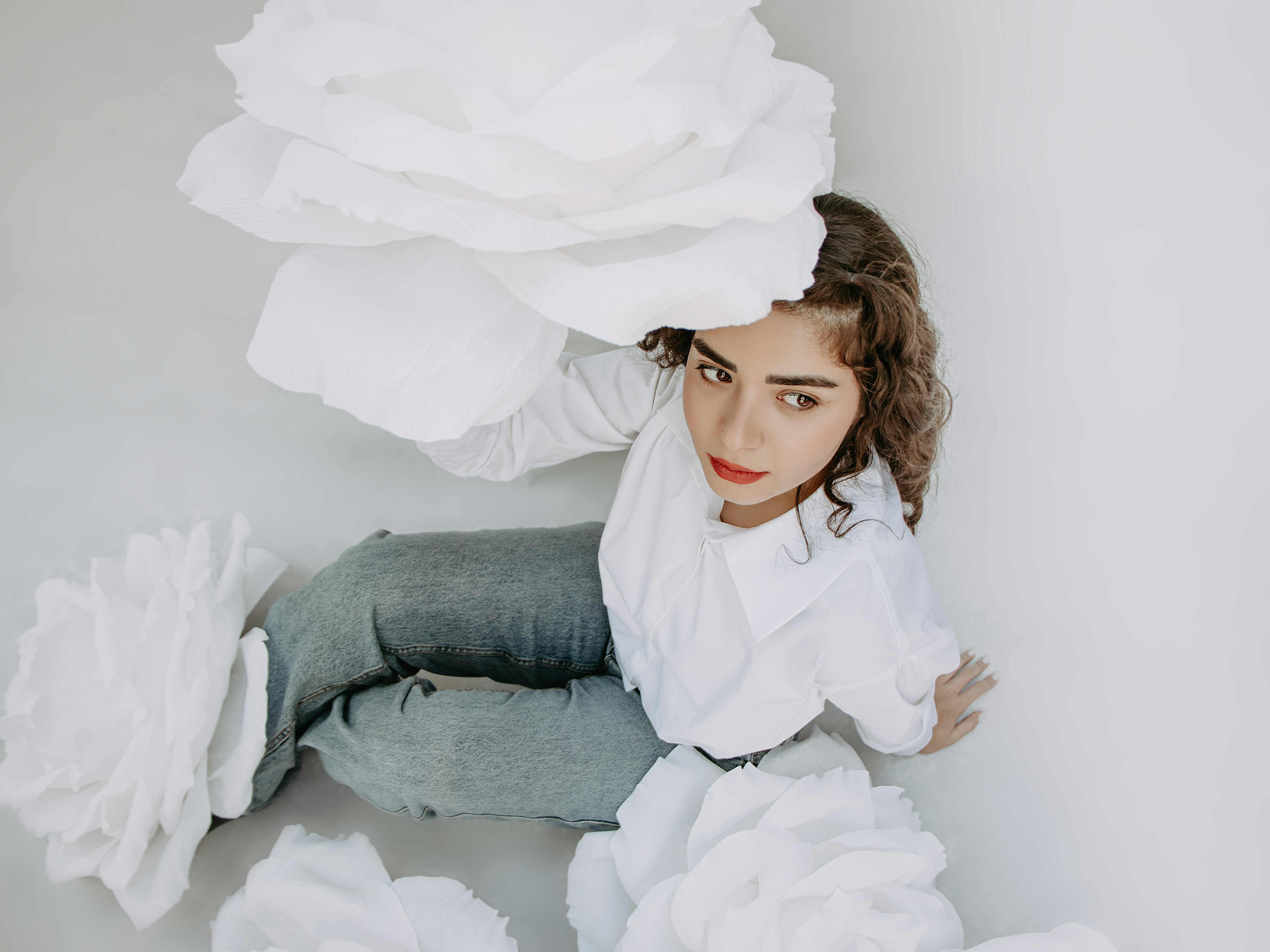 Floating Petals: A Portrait in Soft White and Quiet Mirrors