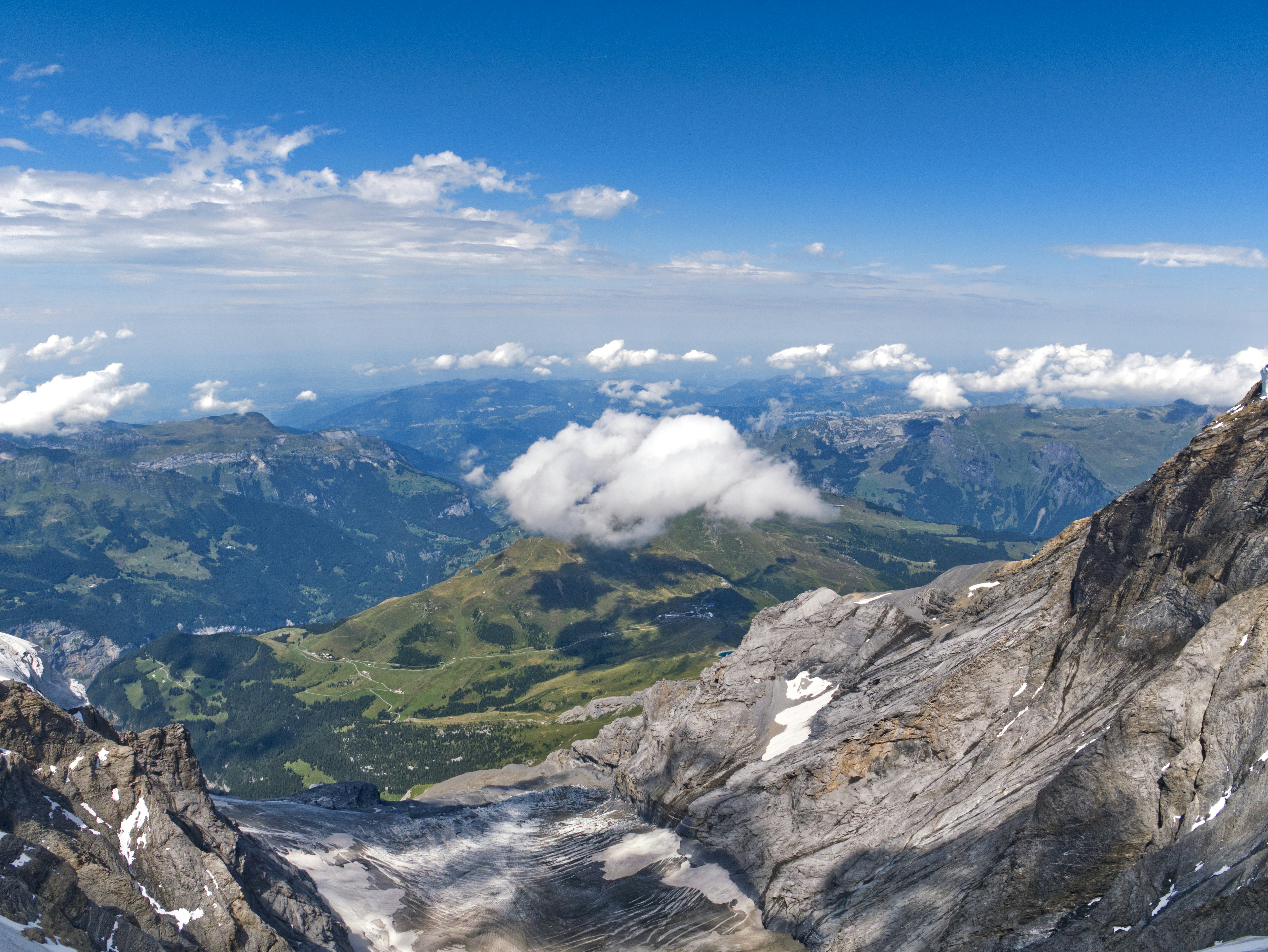 A view of a mountain range from the top of a mountain photo – Free ...