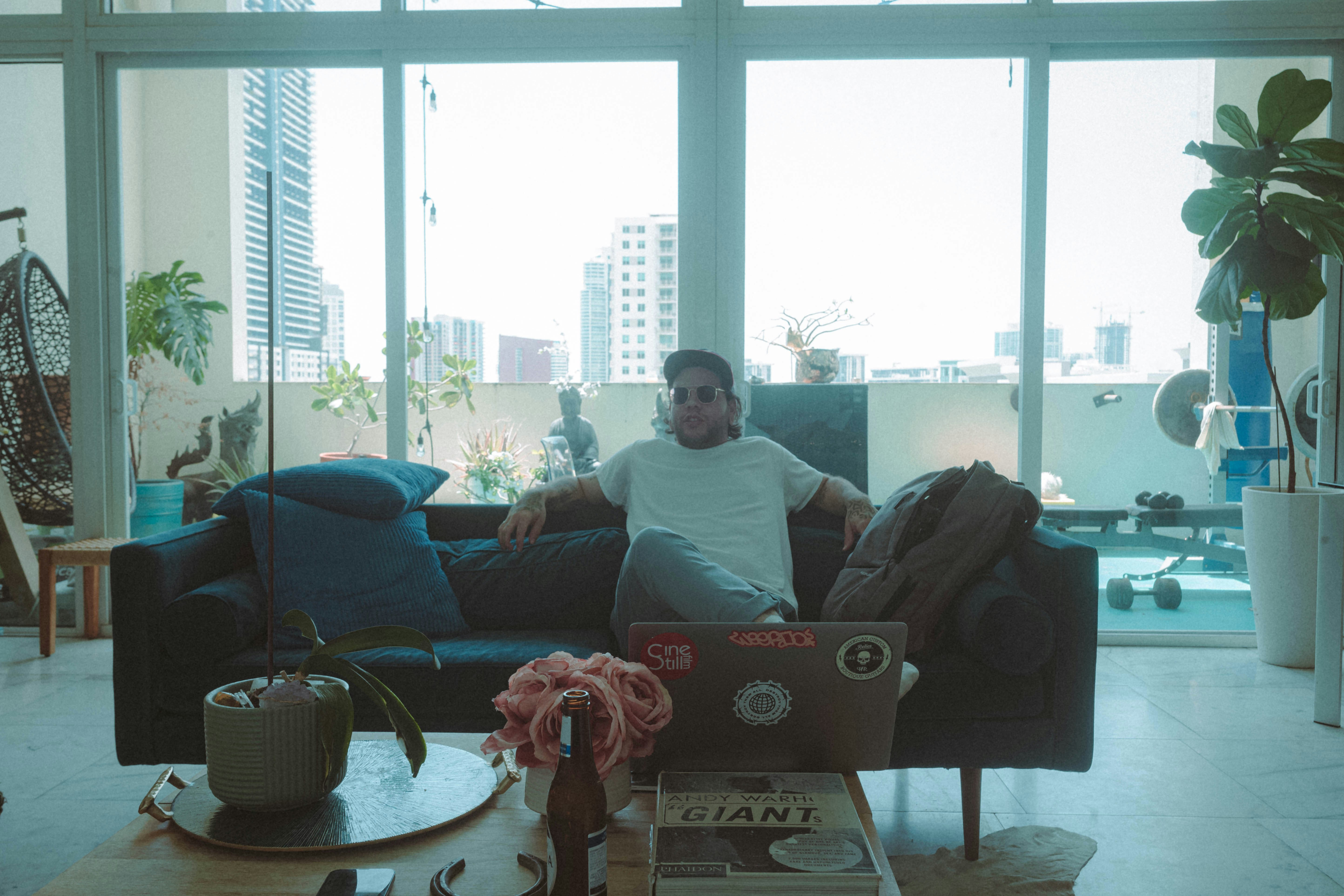 a man sitting on a couch in a living room