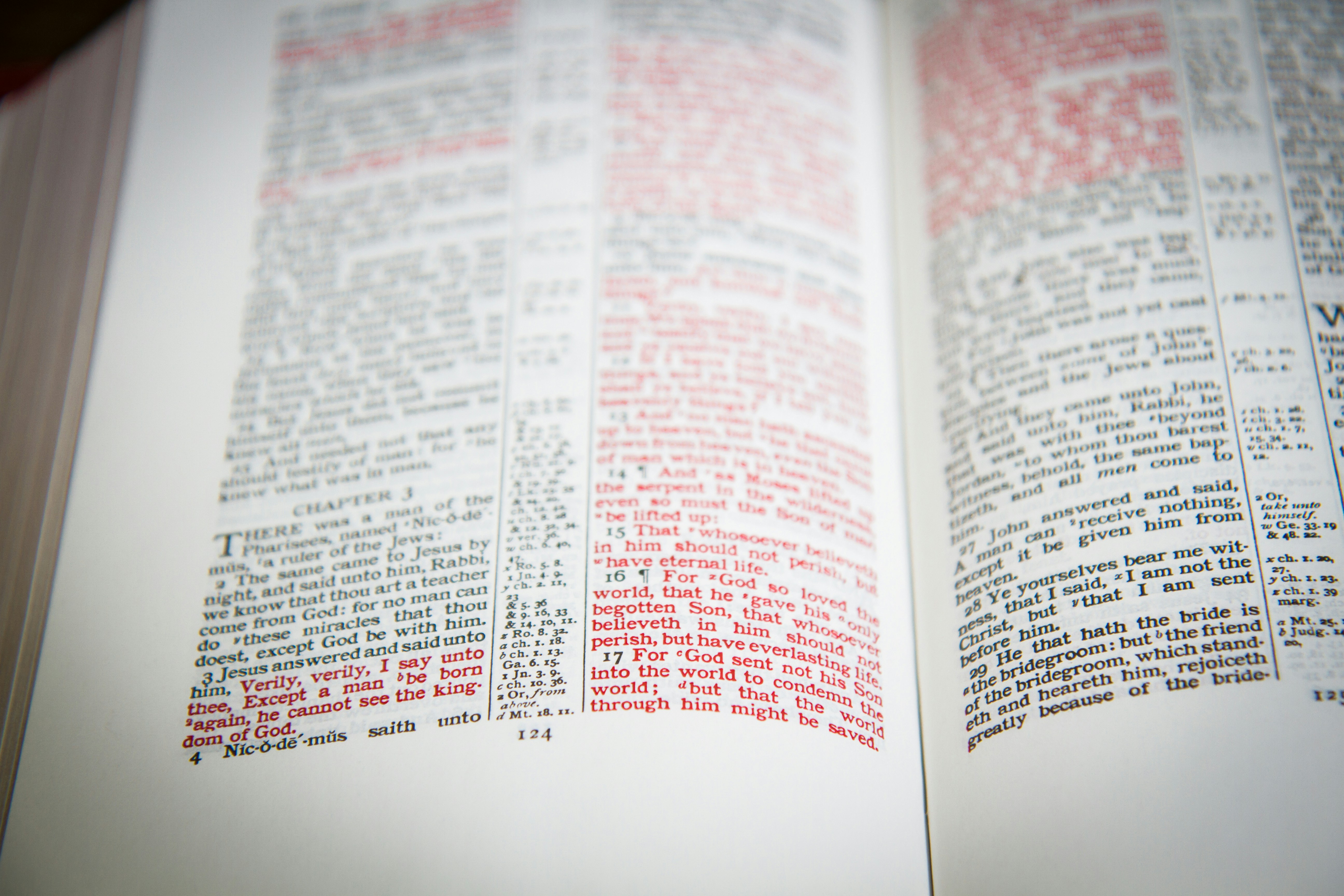 A close up of an open book with red text photo – Free Book Image on ...