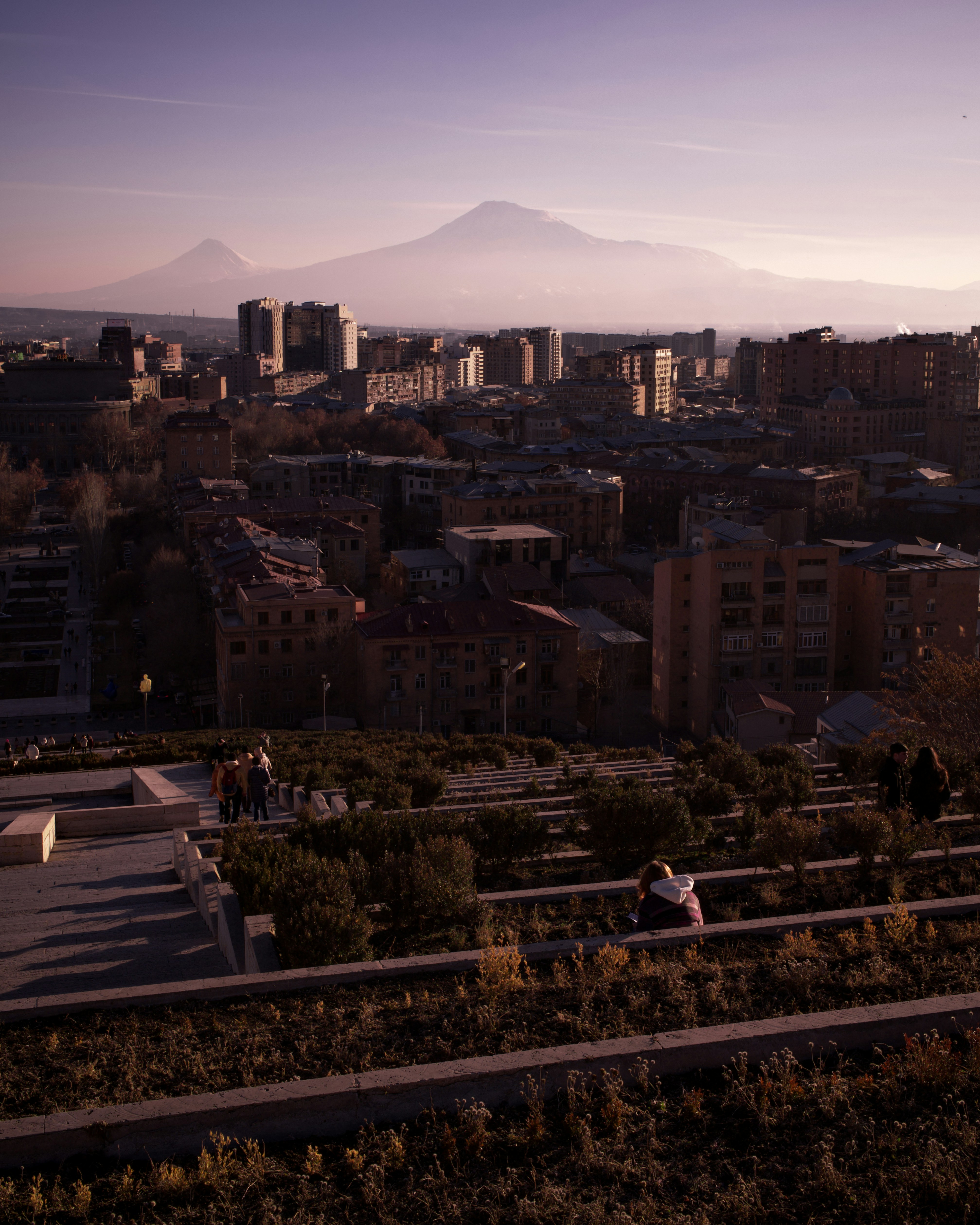 Golden Hour Overlook: Cityscape Framed by Distant Peaks