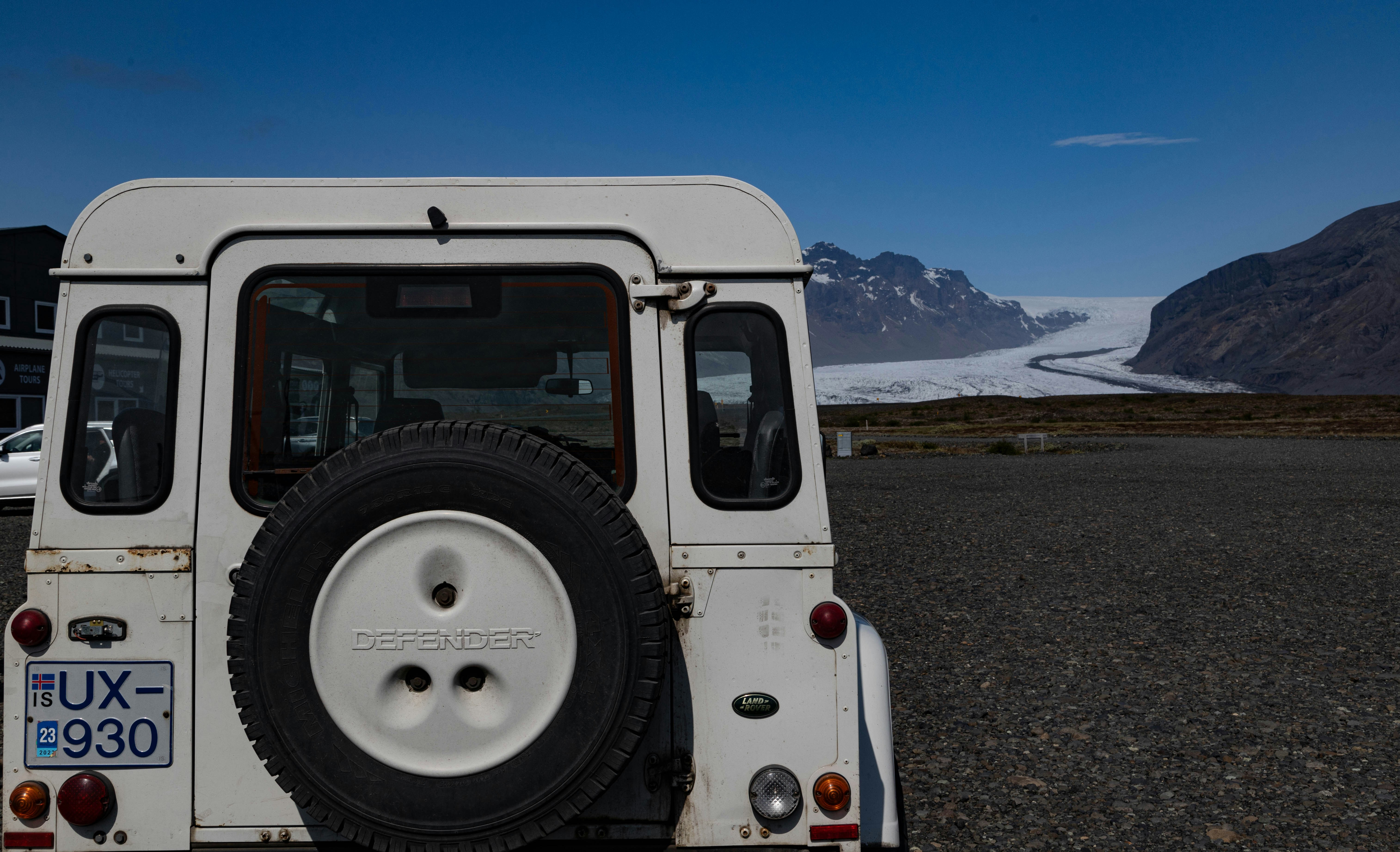 White Off-Road Back View Against Icelandic Glacial Coast