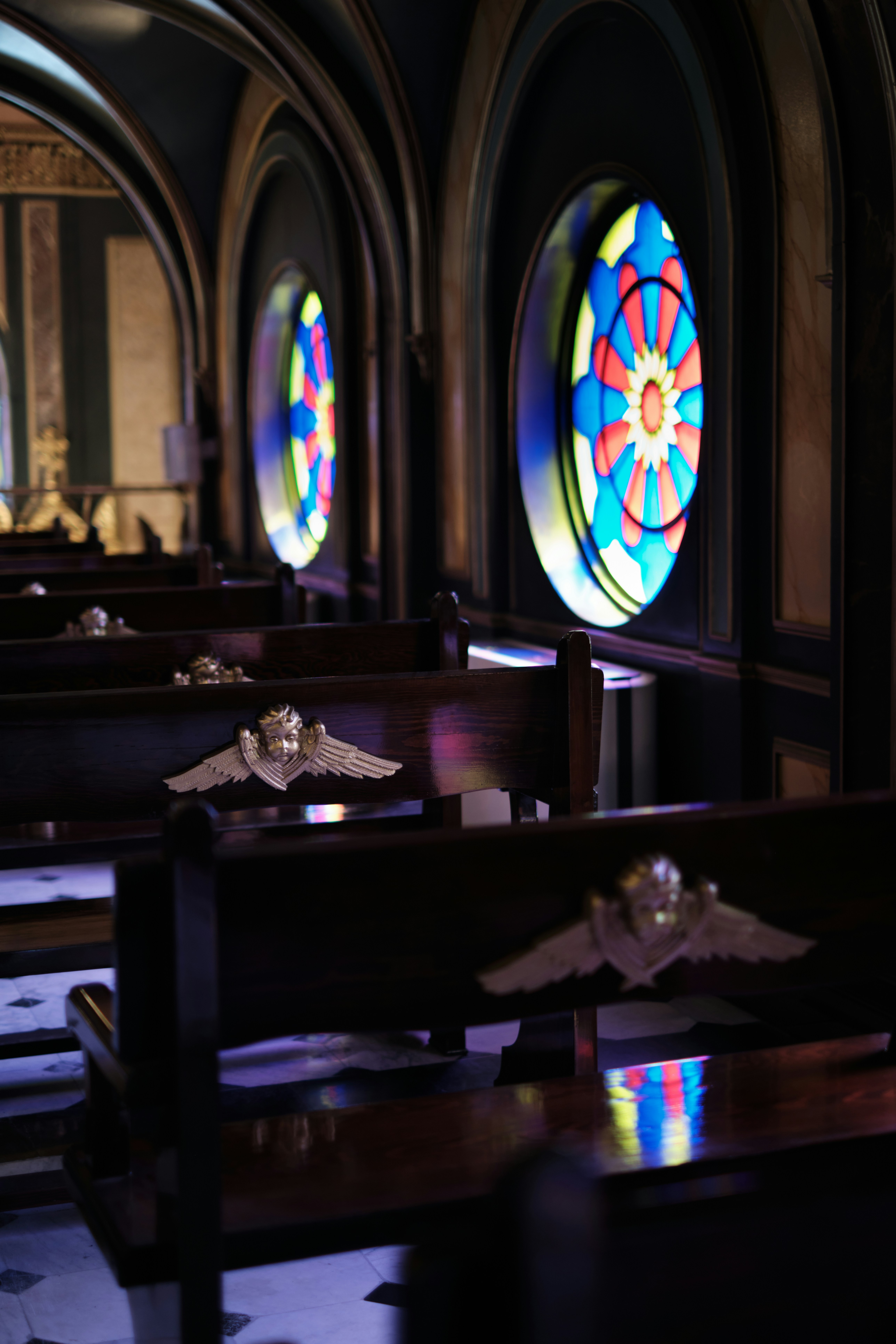 Rose Windows Over Quiet Pews: Light Filtering Through a Wooden Church