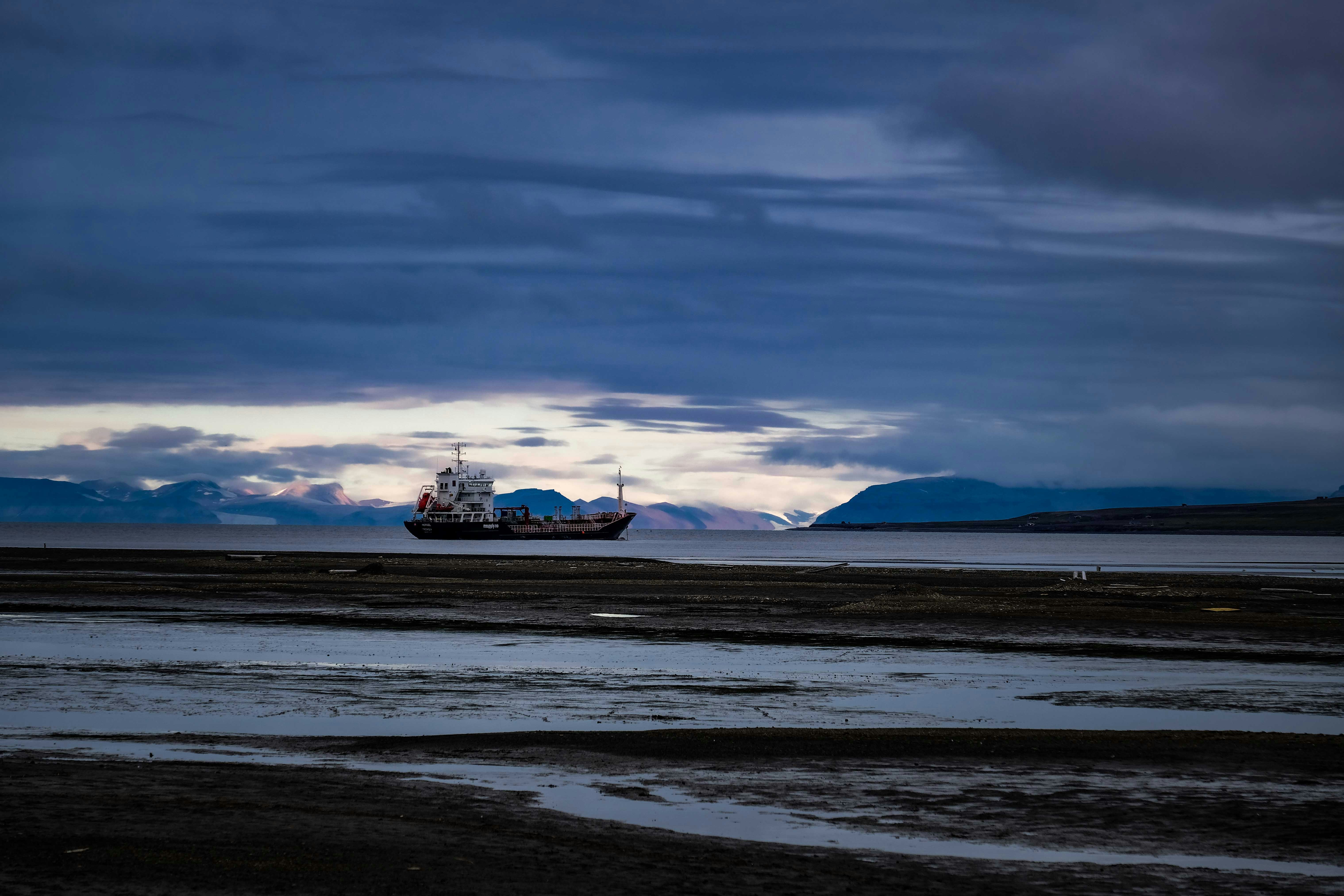 A large cargo ship in a body of water photo – Free Longyearbyen Image ...