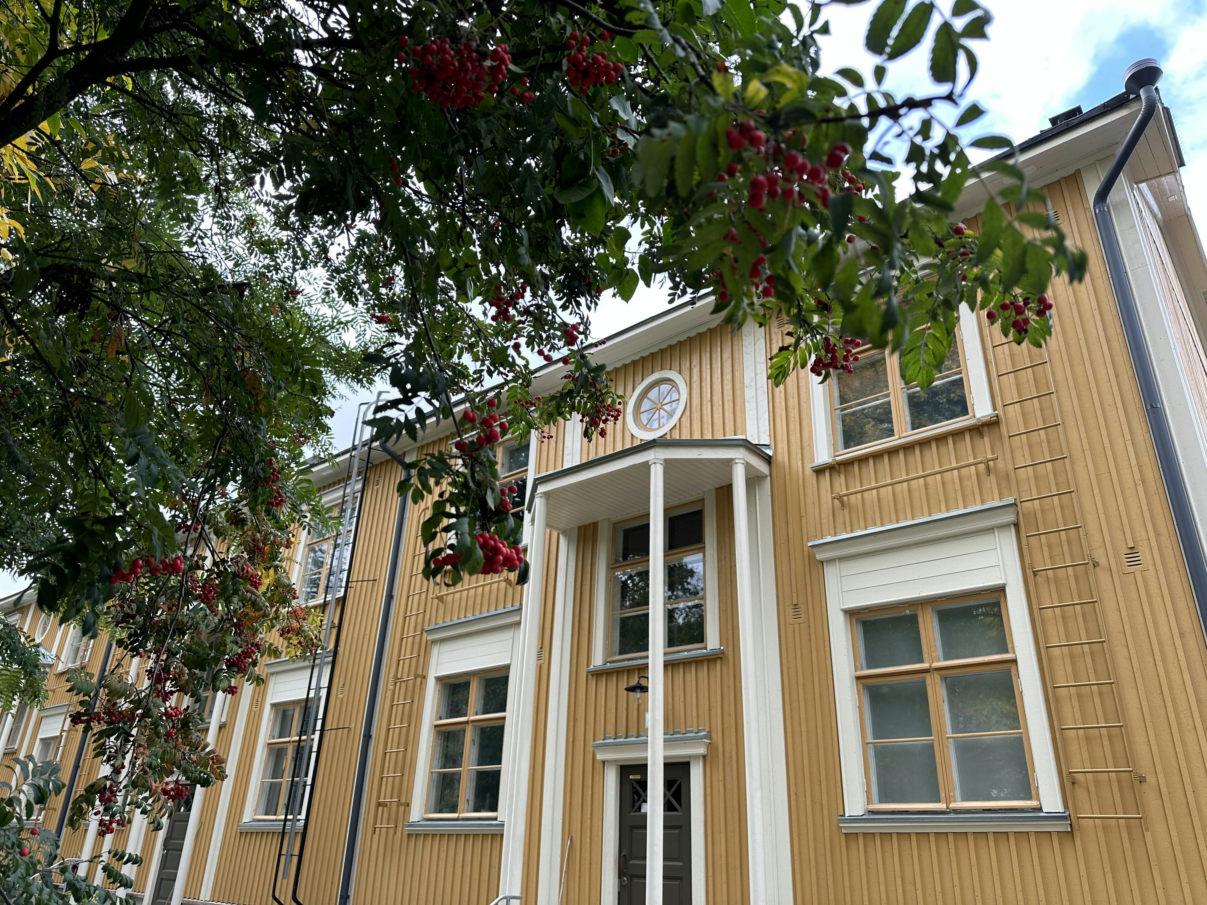 A cute old wooden house in calm district in Scandinavia.