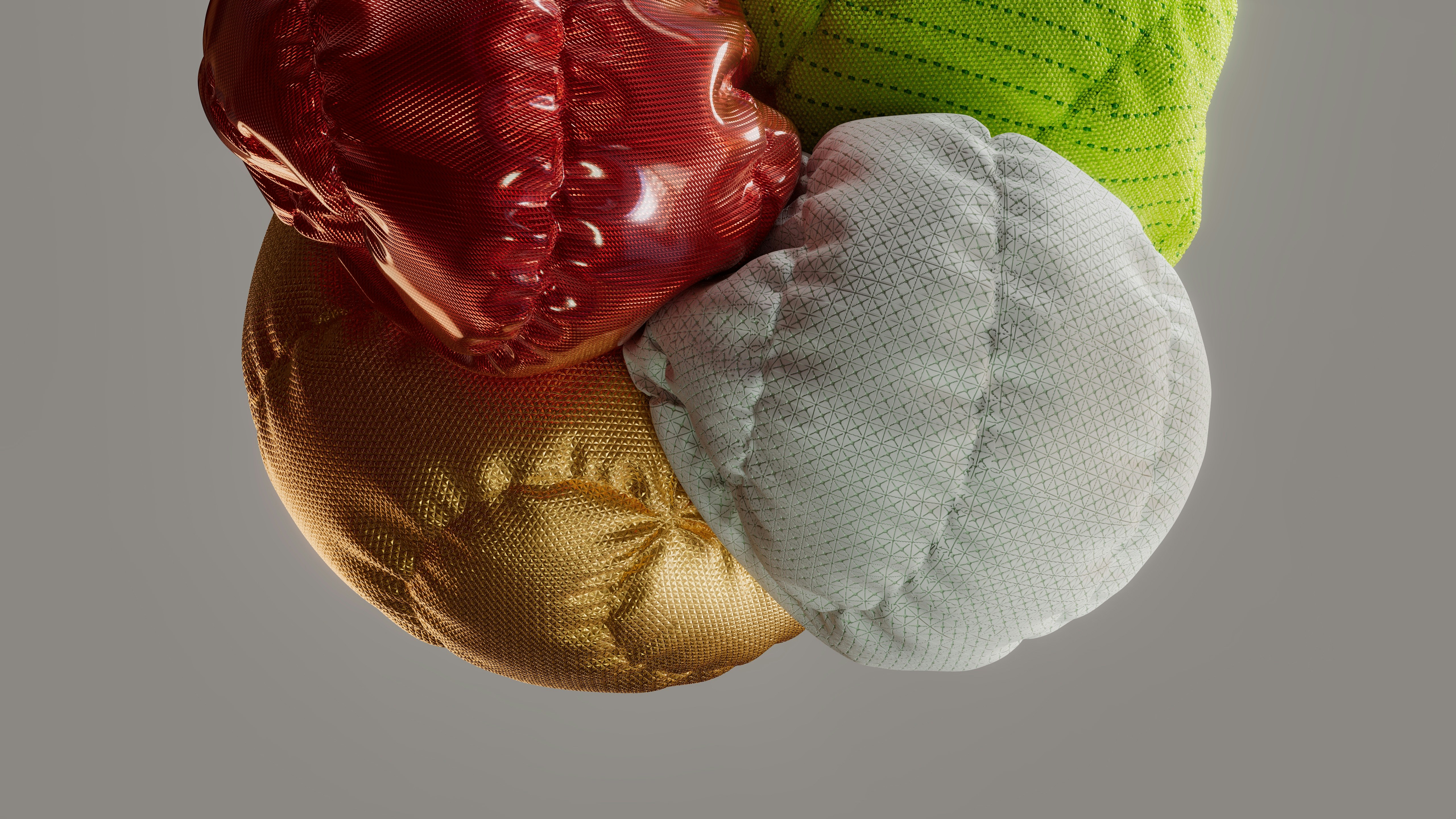 A group of three different colored balls hanging from a string photo ...