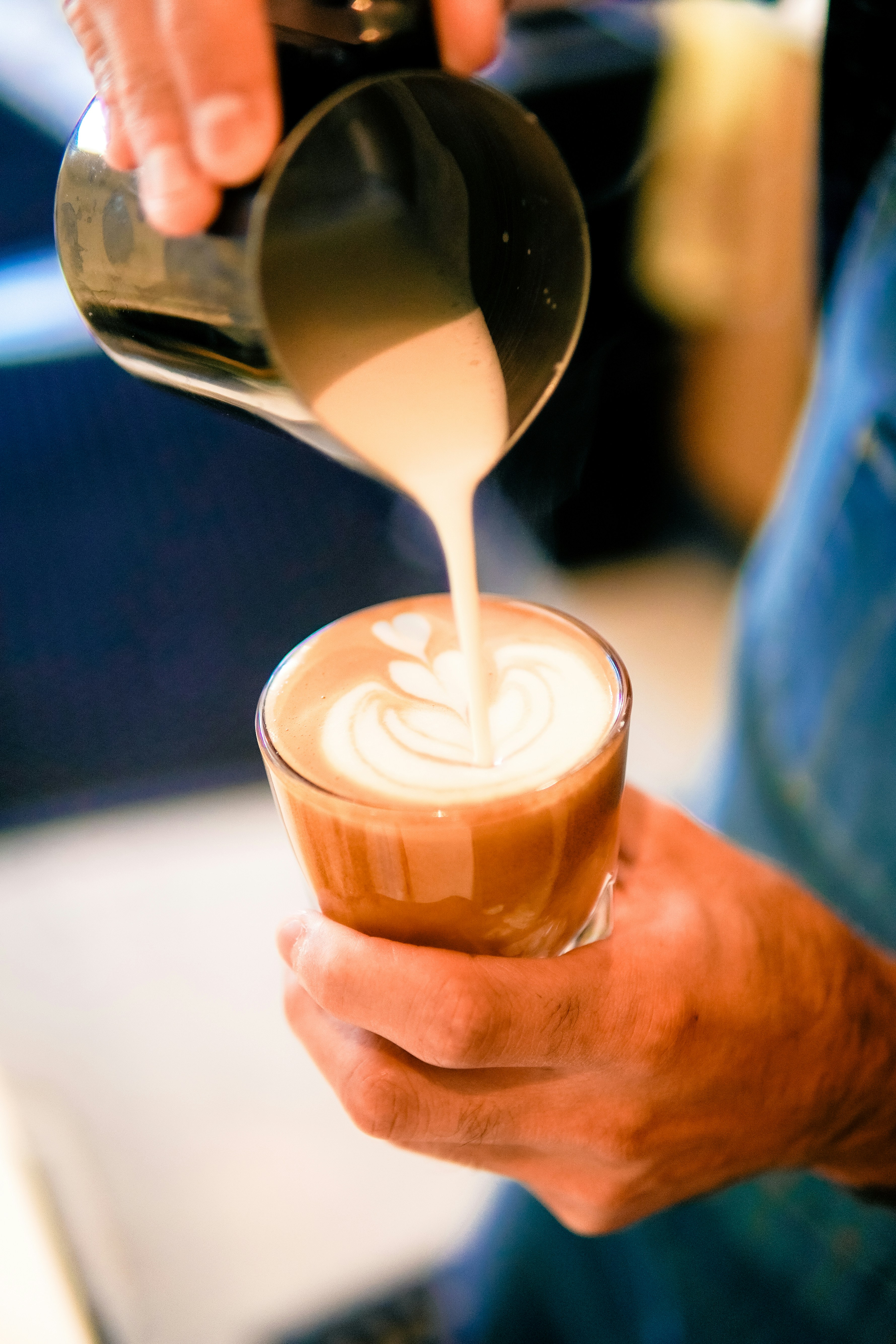 Heart in Foam: Latte Art Frozen in a Mid-Pour Moment