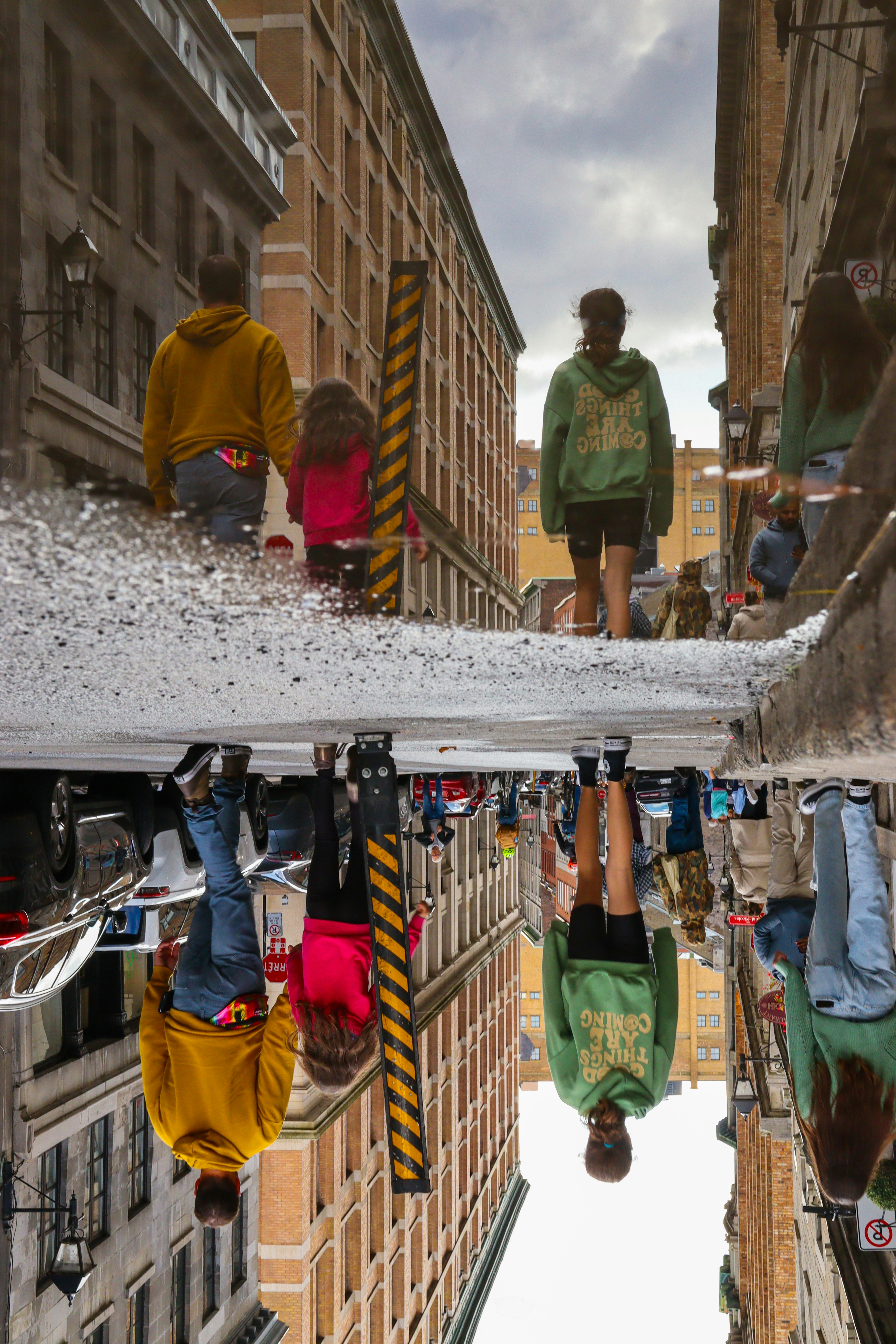 A reflection of a person hanging upside down in a puddle photo – Free ...