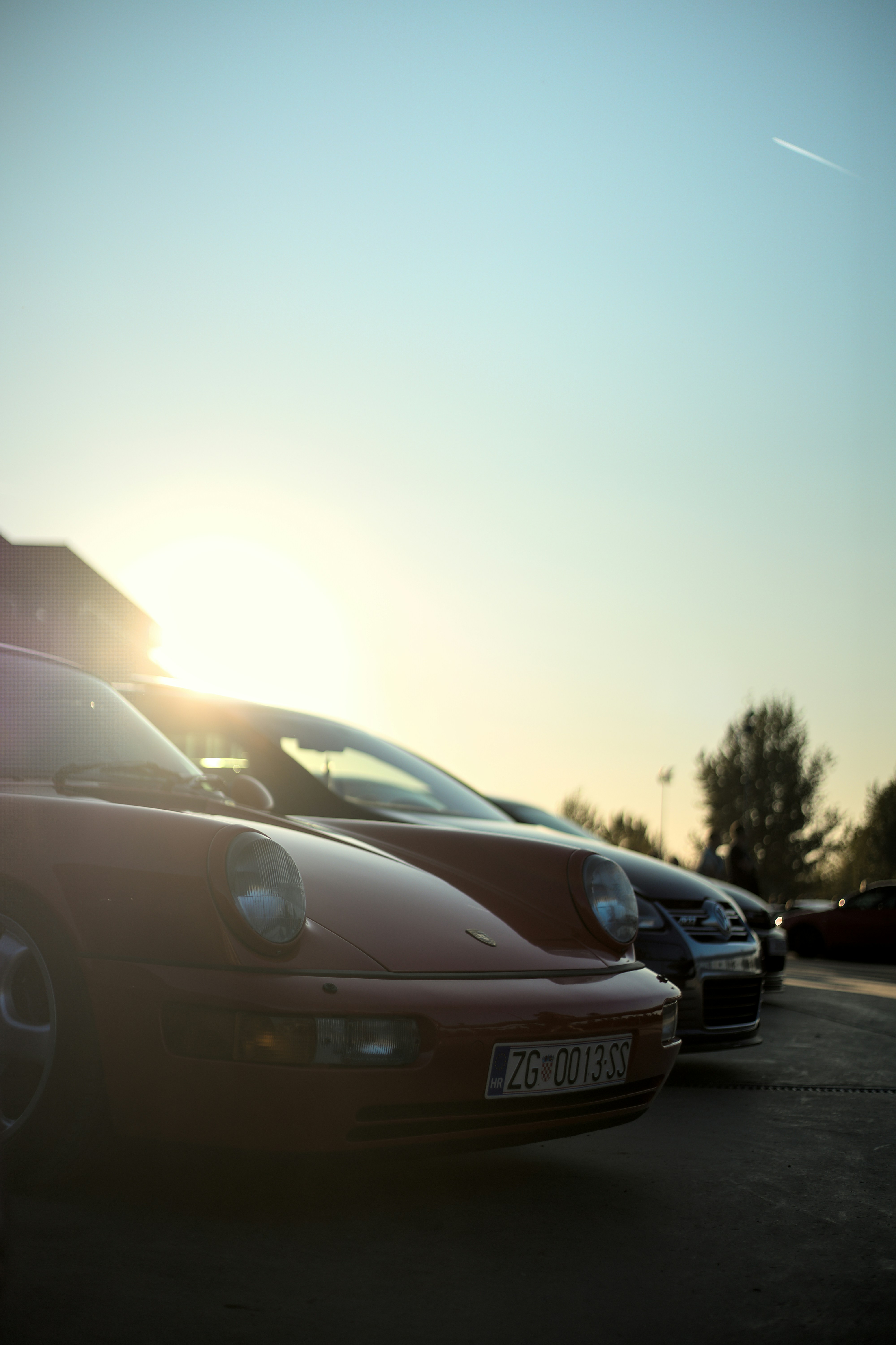 Golden Hour Front: A Row of Classic Porsches at Dusk