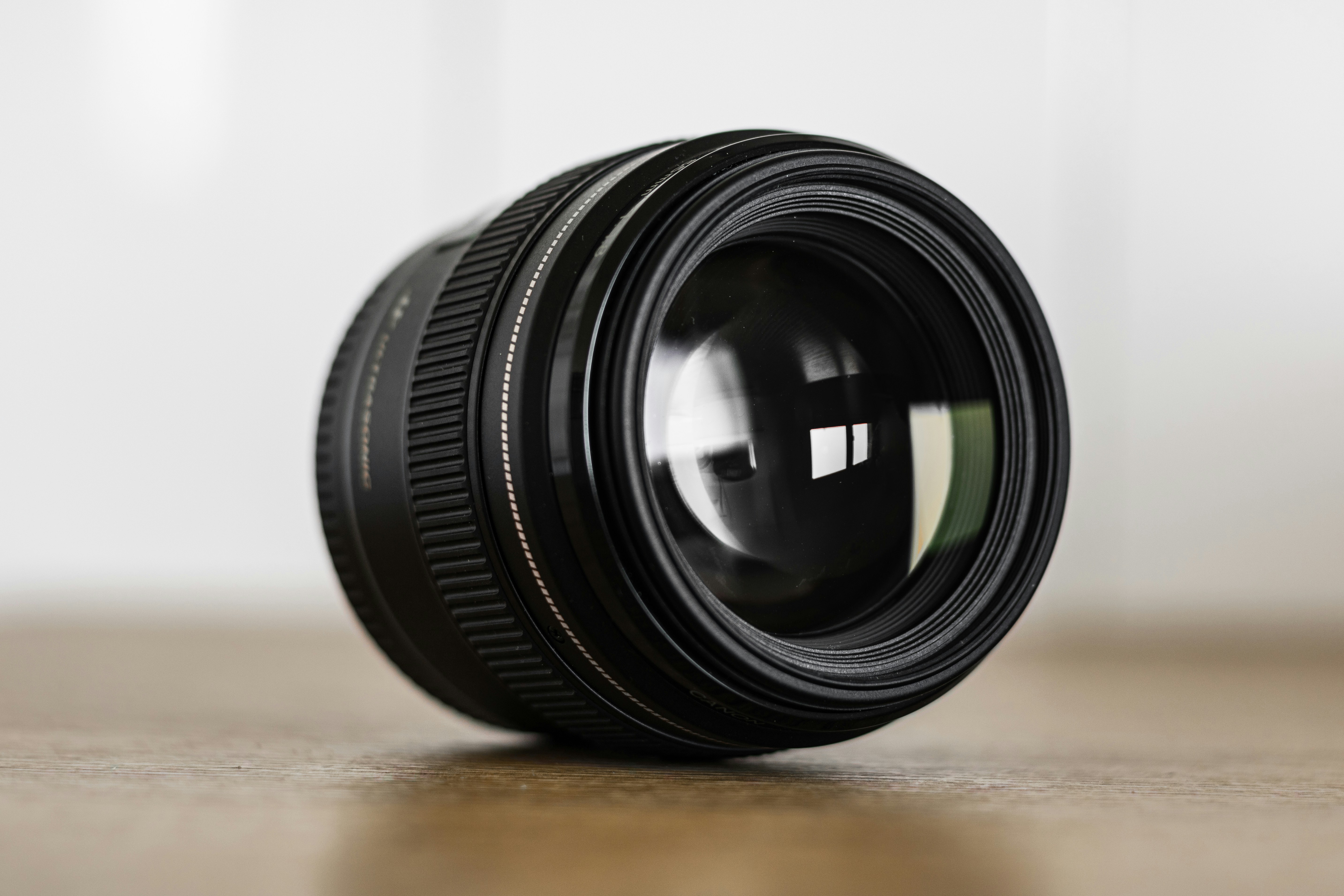 A close up of a camera lens on a table photo – Free Camera lens Image ...