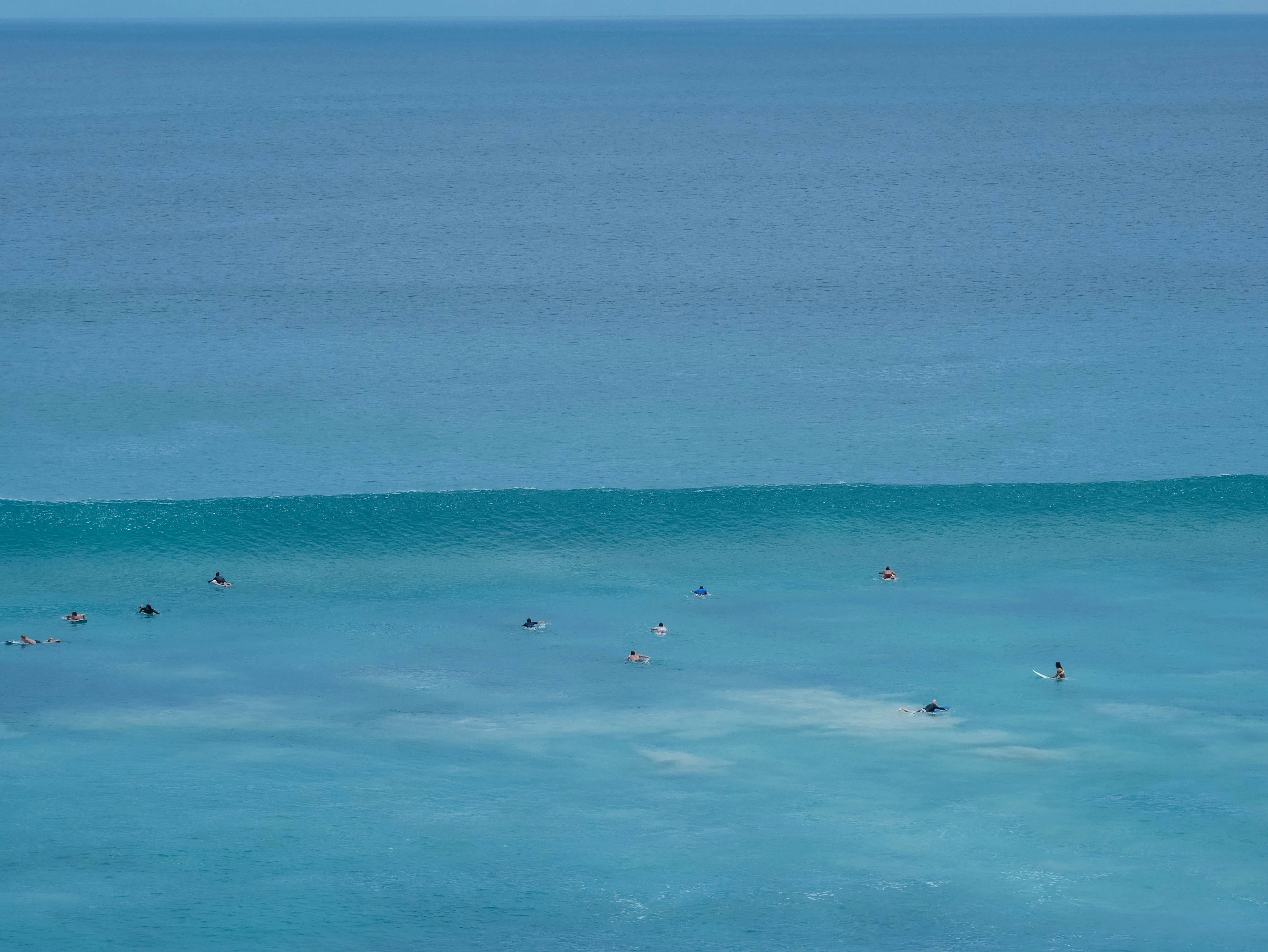 Dotted Silhouettes on a Quiet Ocean Canvas
