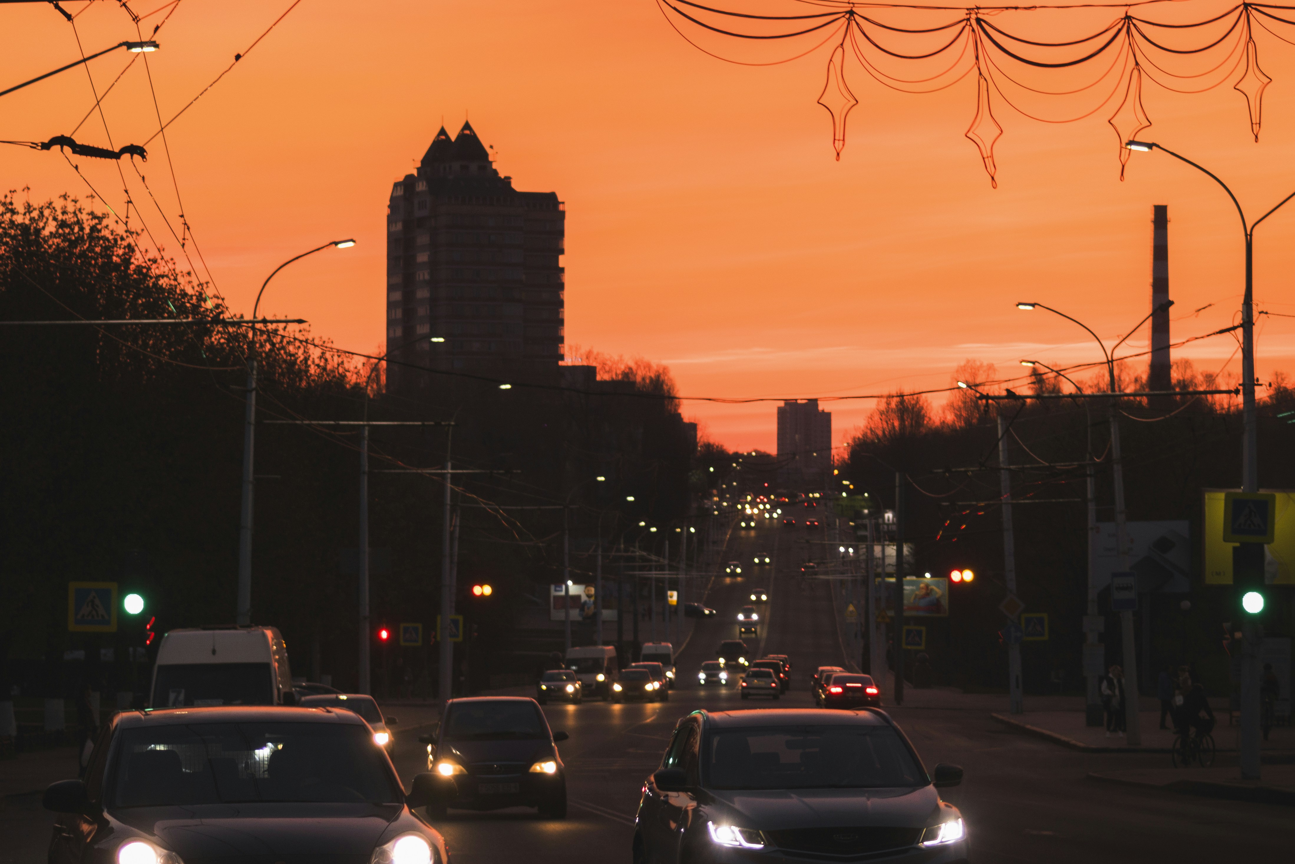 Dusk Convergence: Sunset Traffic Through a City Corridor