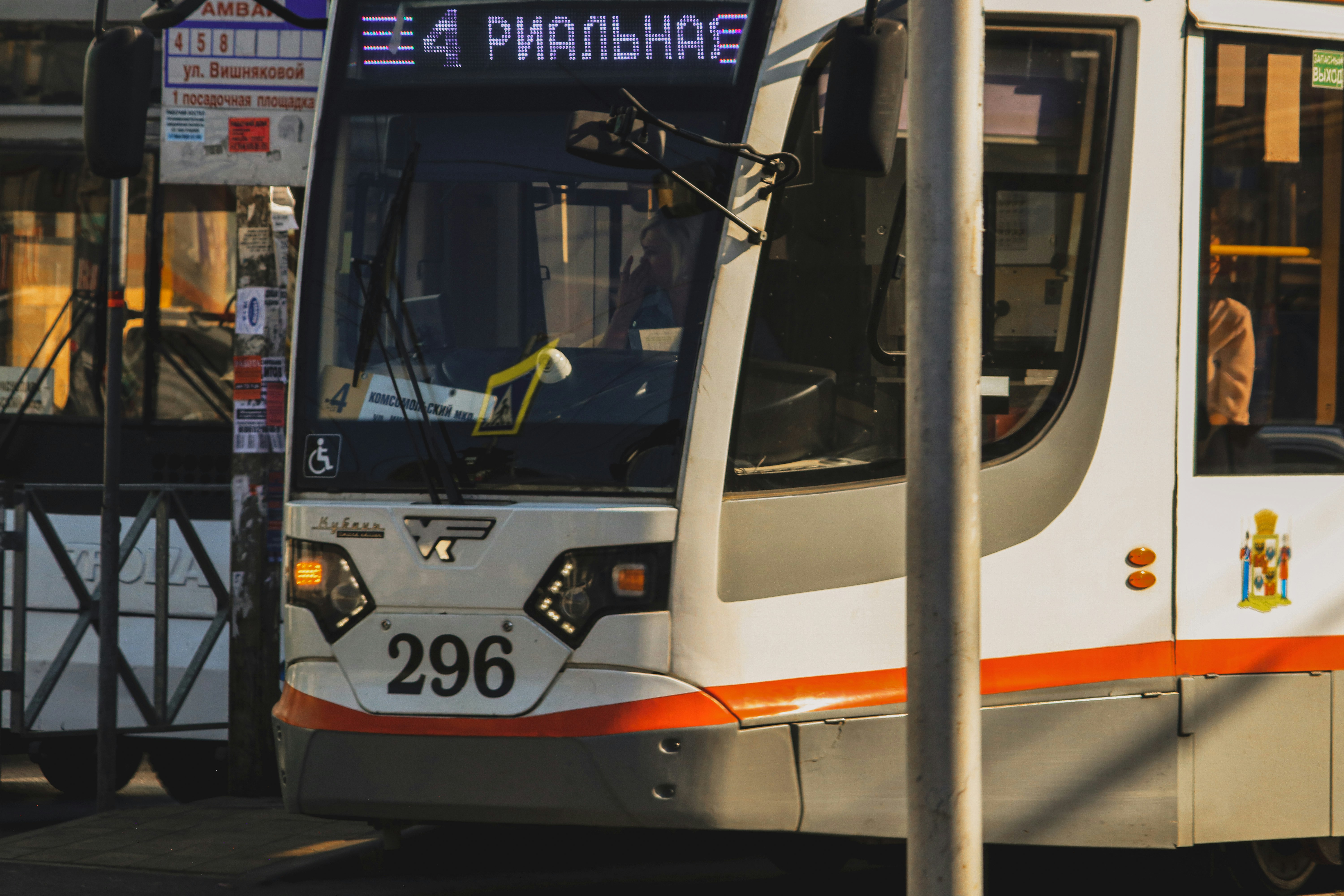 A public transit bus on a city street photo – Free Streetcar Image on ...