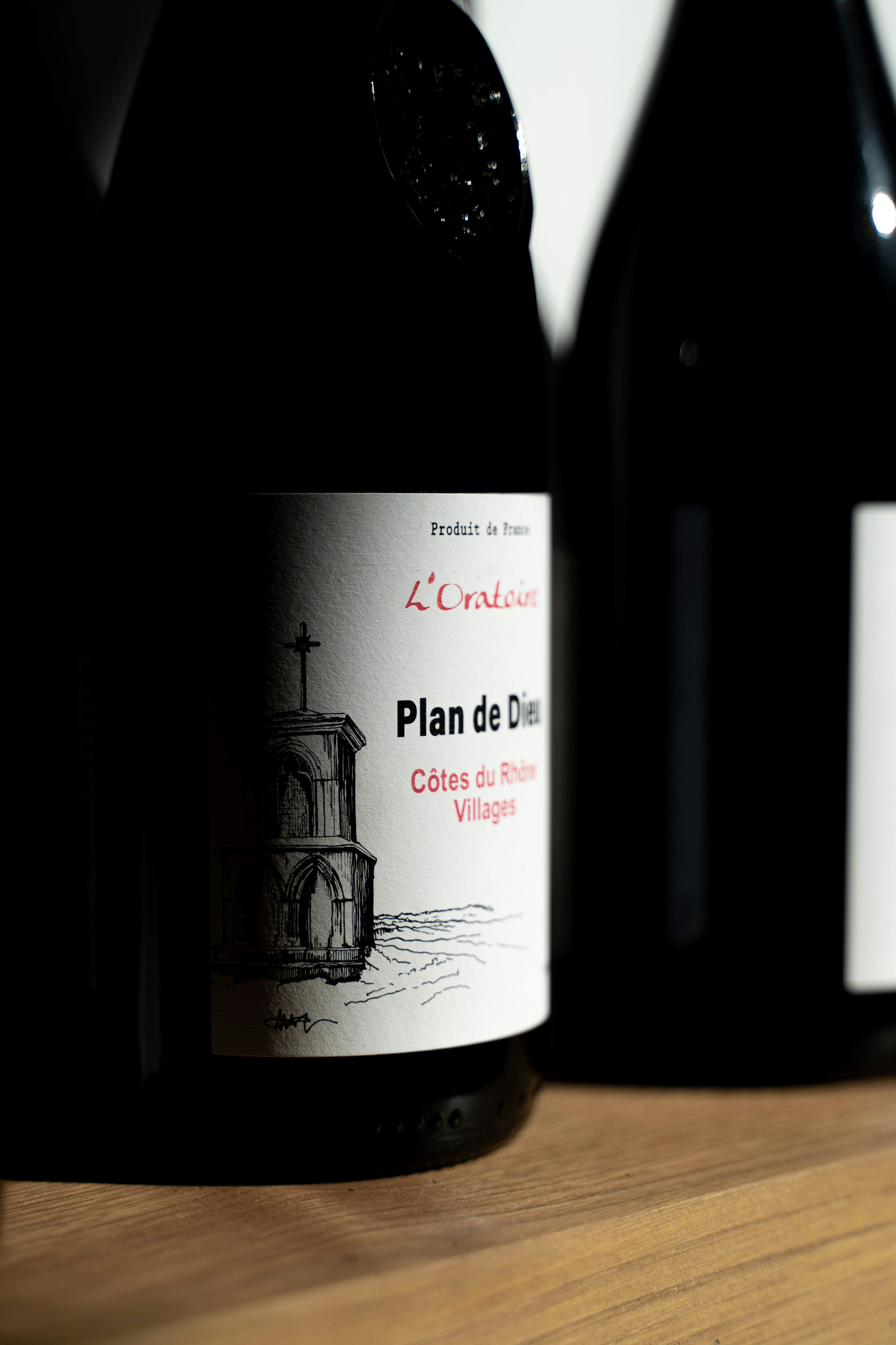 Plan de Dieu Under Soft Spotlight: A Close-Up of Bottles on Wood