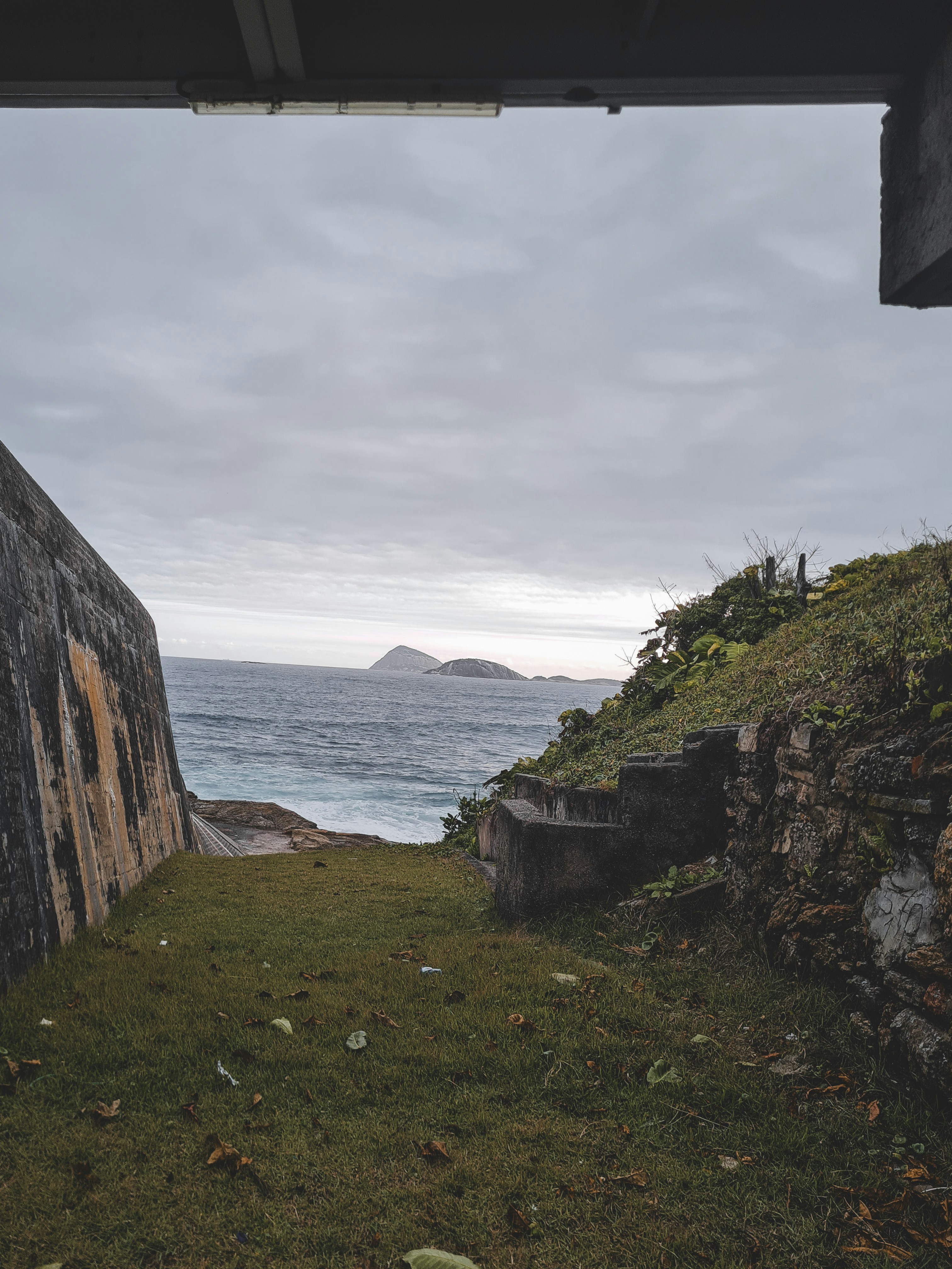 Framed Coastline: A Grassy Path Toward Distant Islands