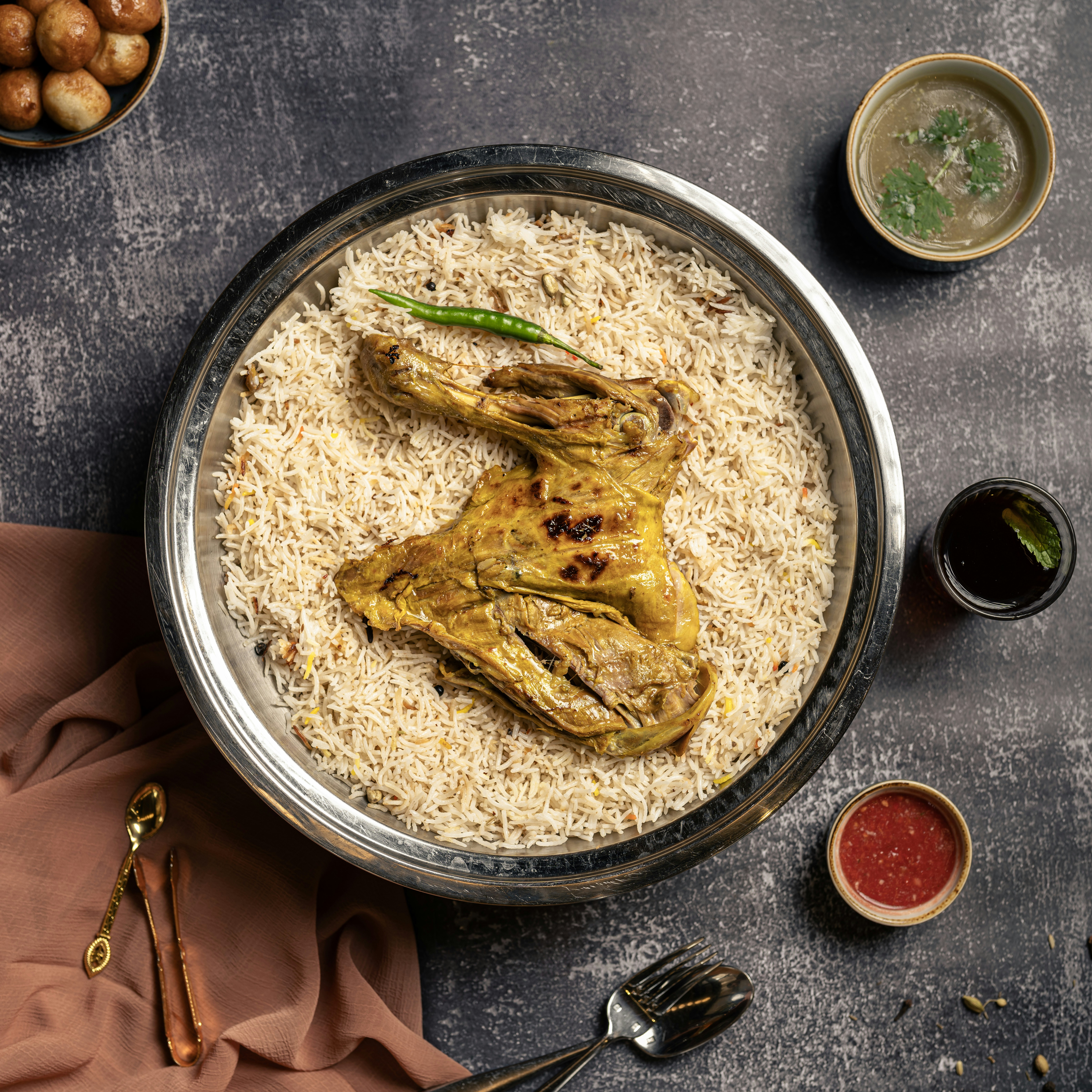 A plate of food with rice, meat and sauces photo – Free Dubai - united ...