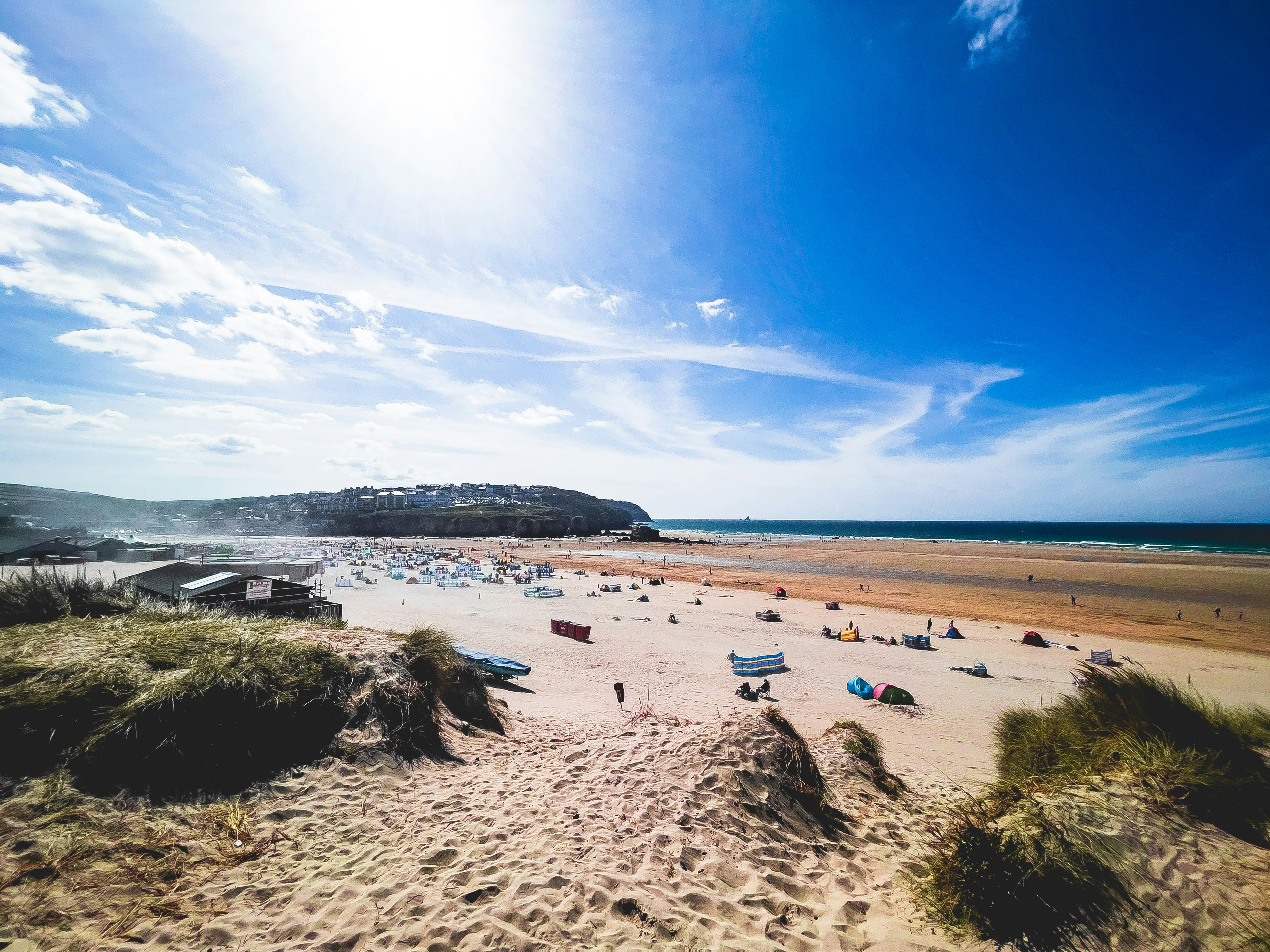 A beach with a lot of people on it photo – Free Perranporth beach Image ...