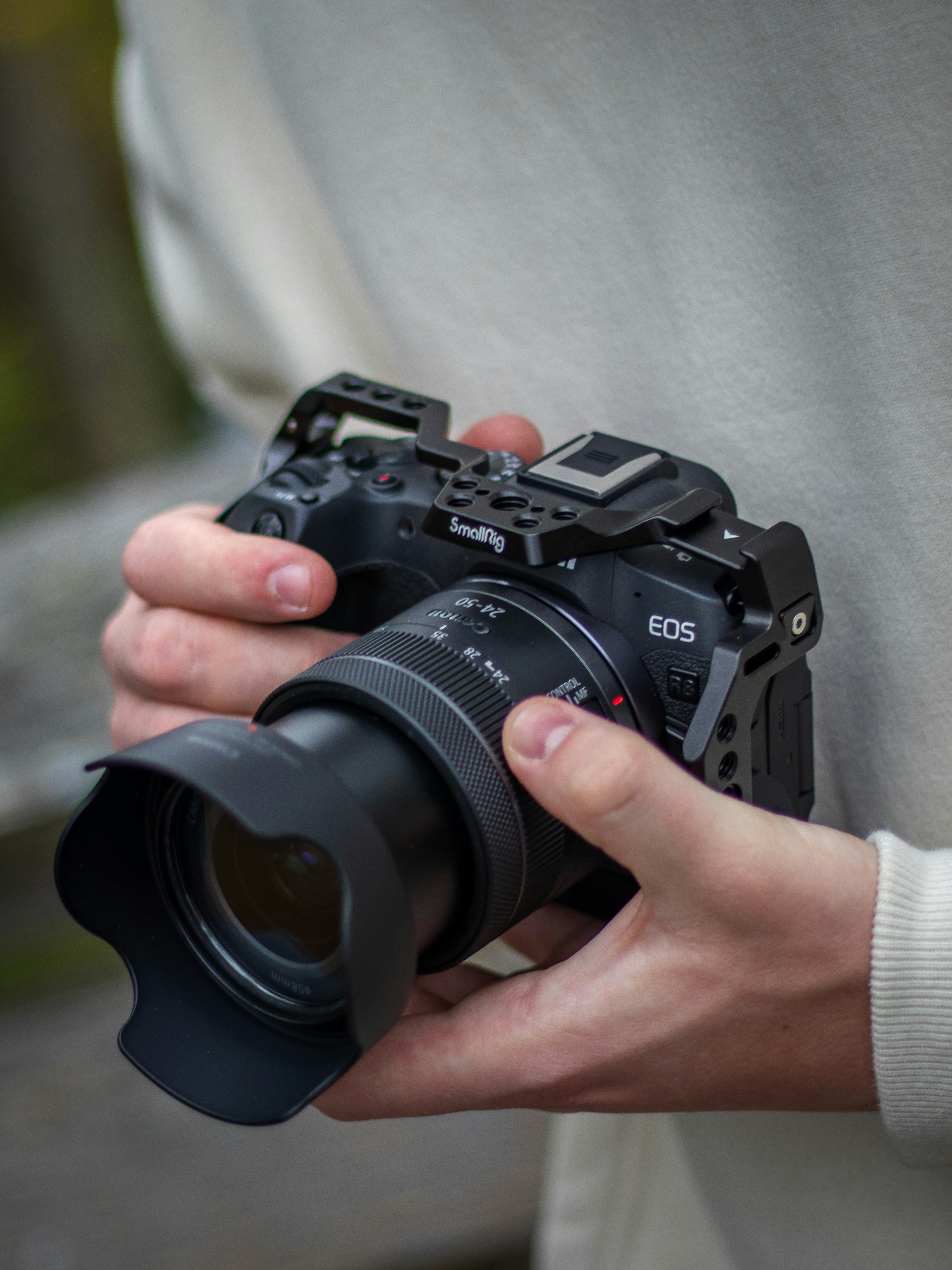 a person holding a camera in their hands