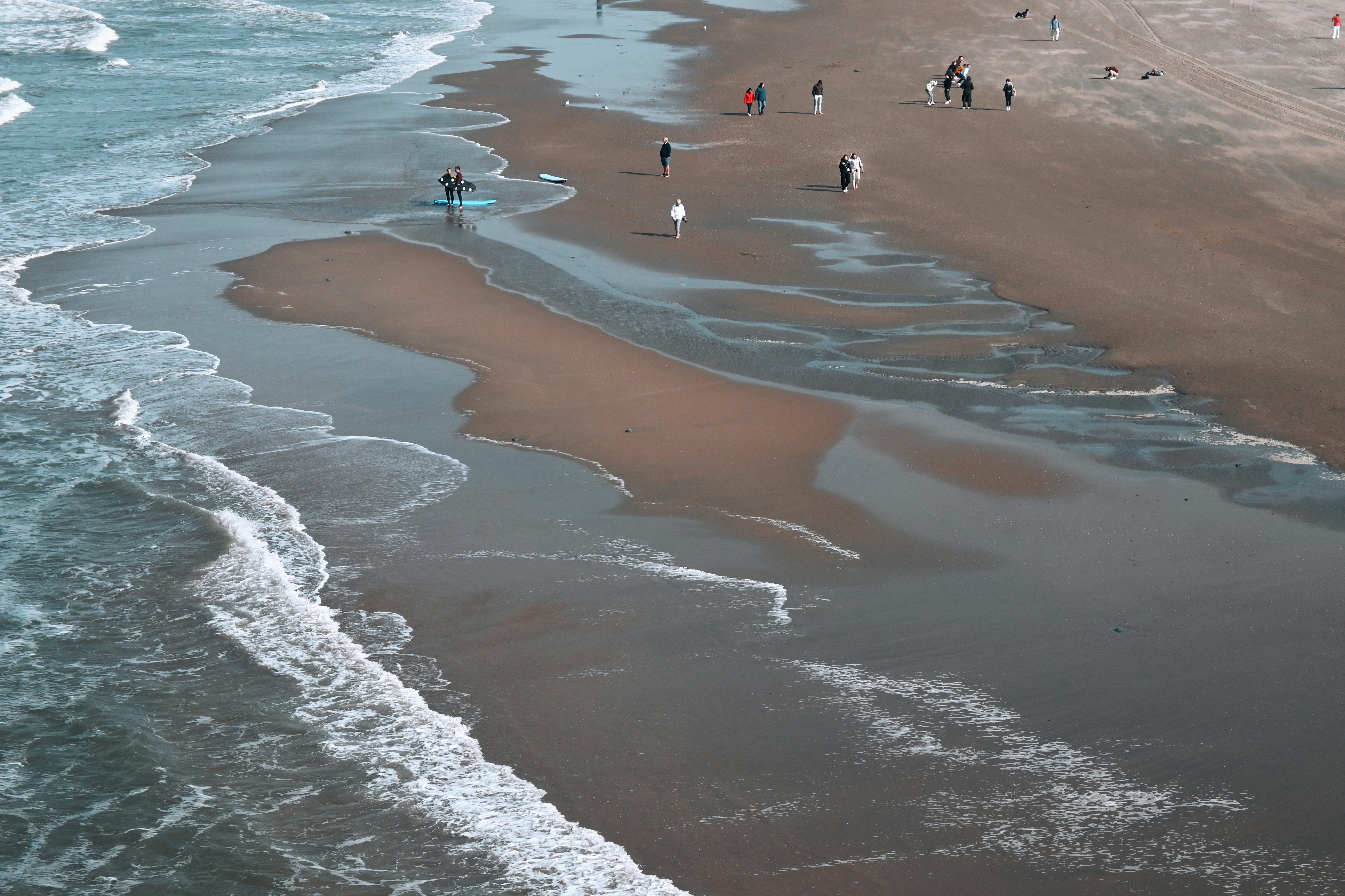 Drifted Rivers of Sand: An Aerial Portrait of Tide Pools and Beachgoers