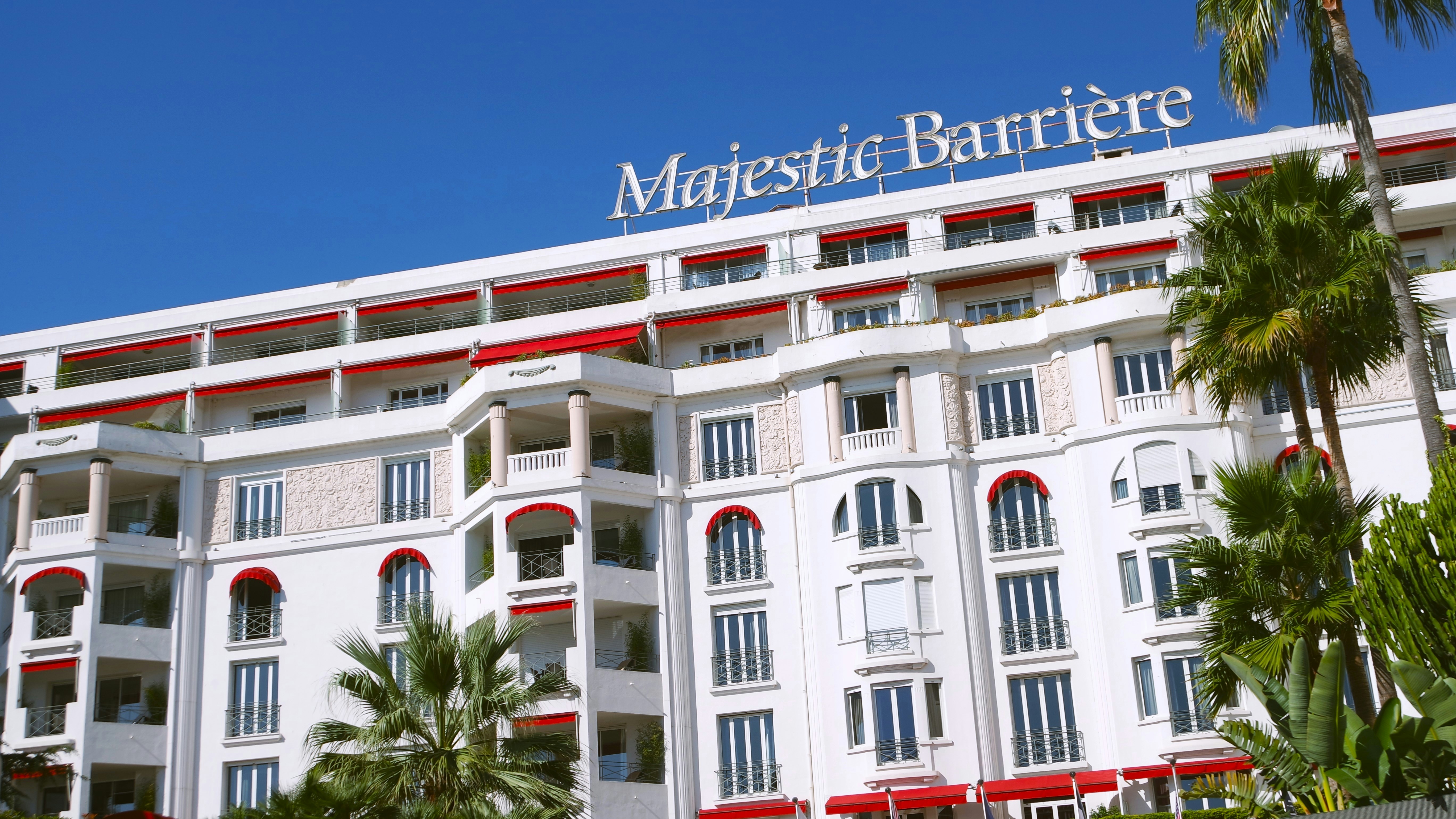 a large white building with a sign on top of it