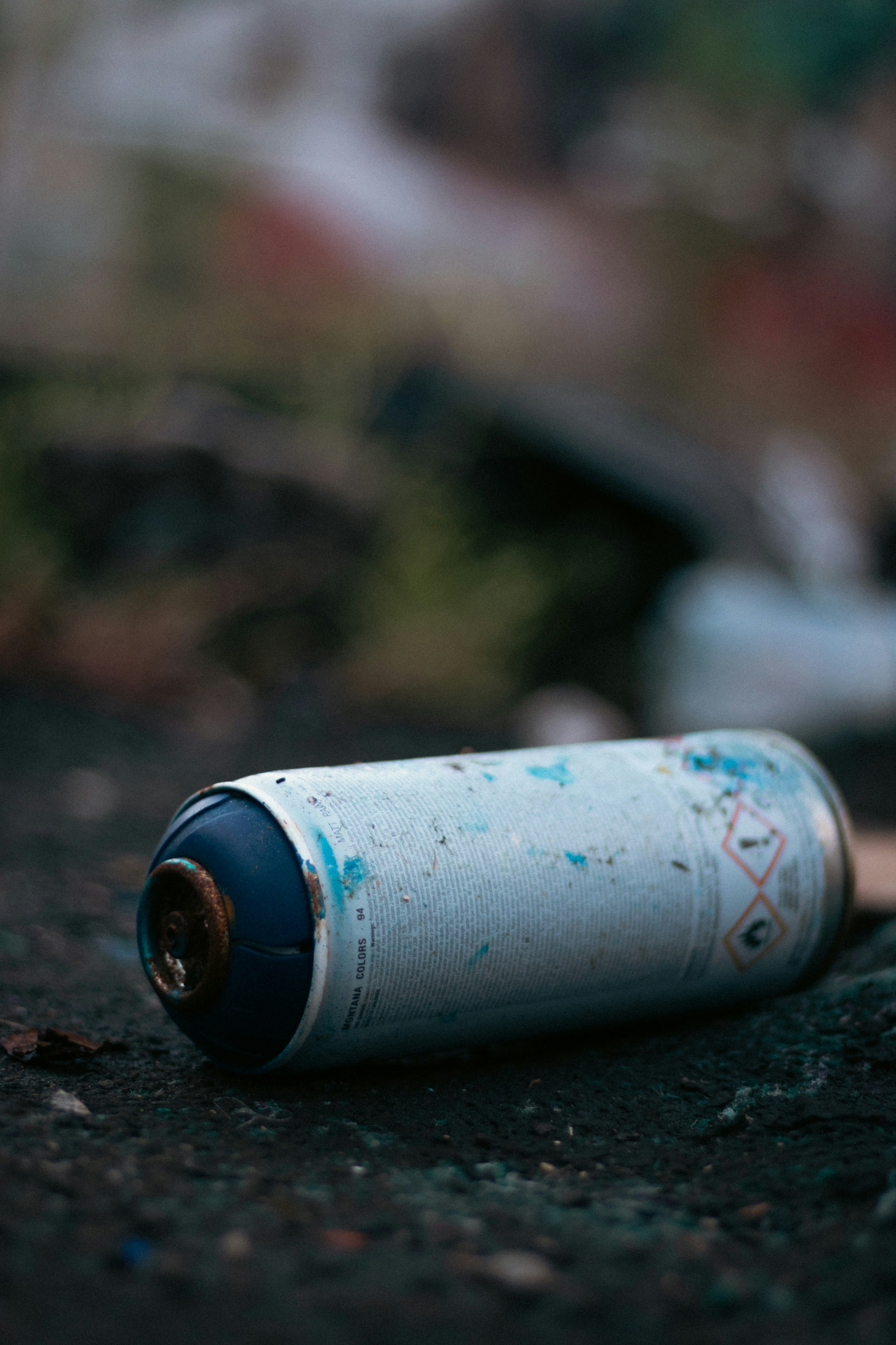 A blue and white lighter laying on the ground photo – Free Graffiti ...