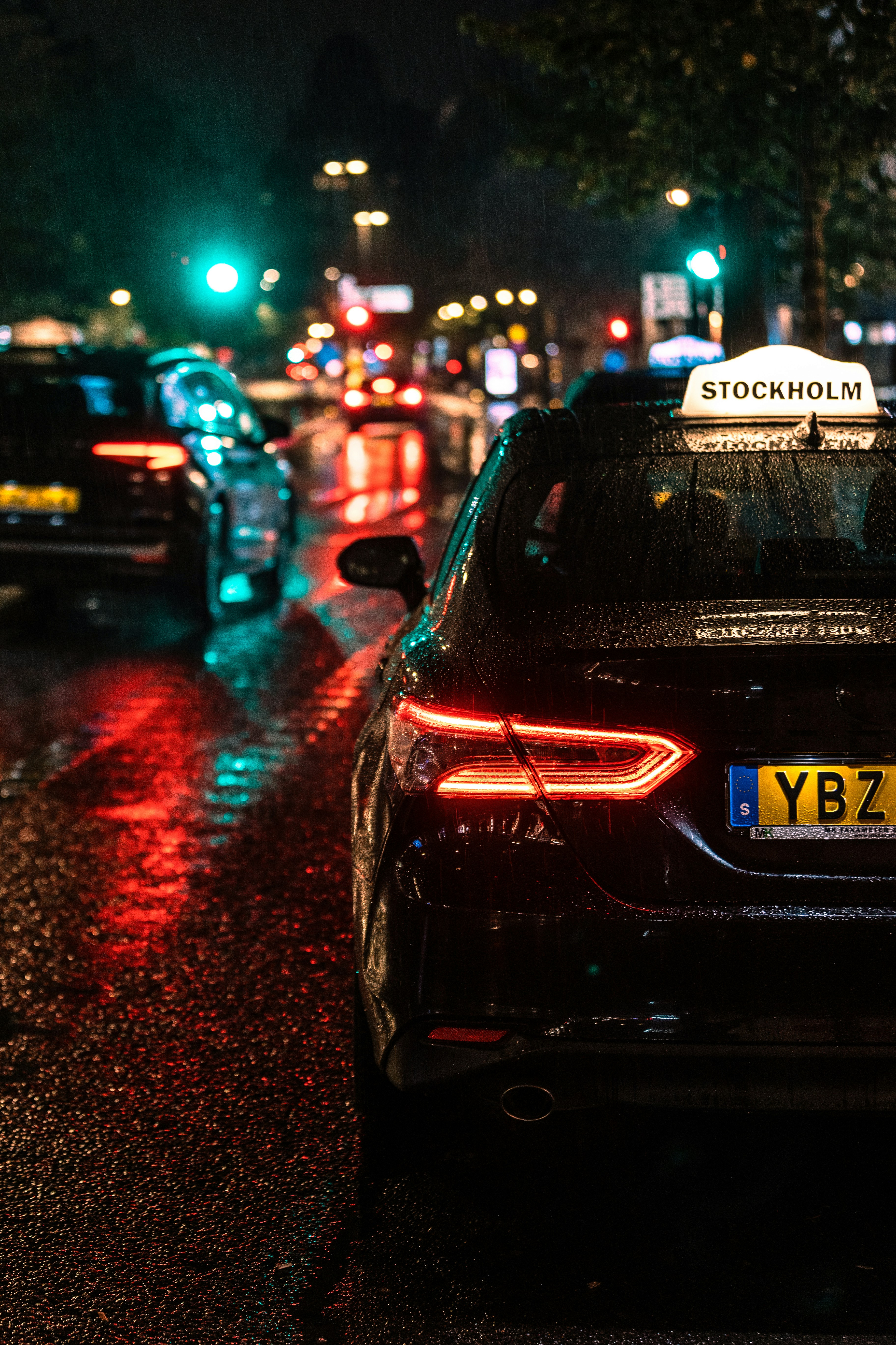Stockholm Night Taxi: Neon Reflections on a Rain-Slick Street