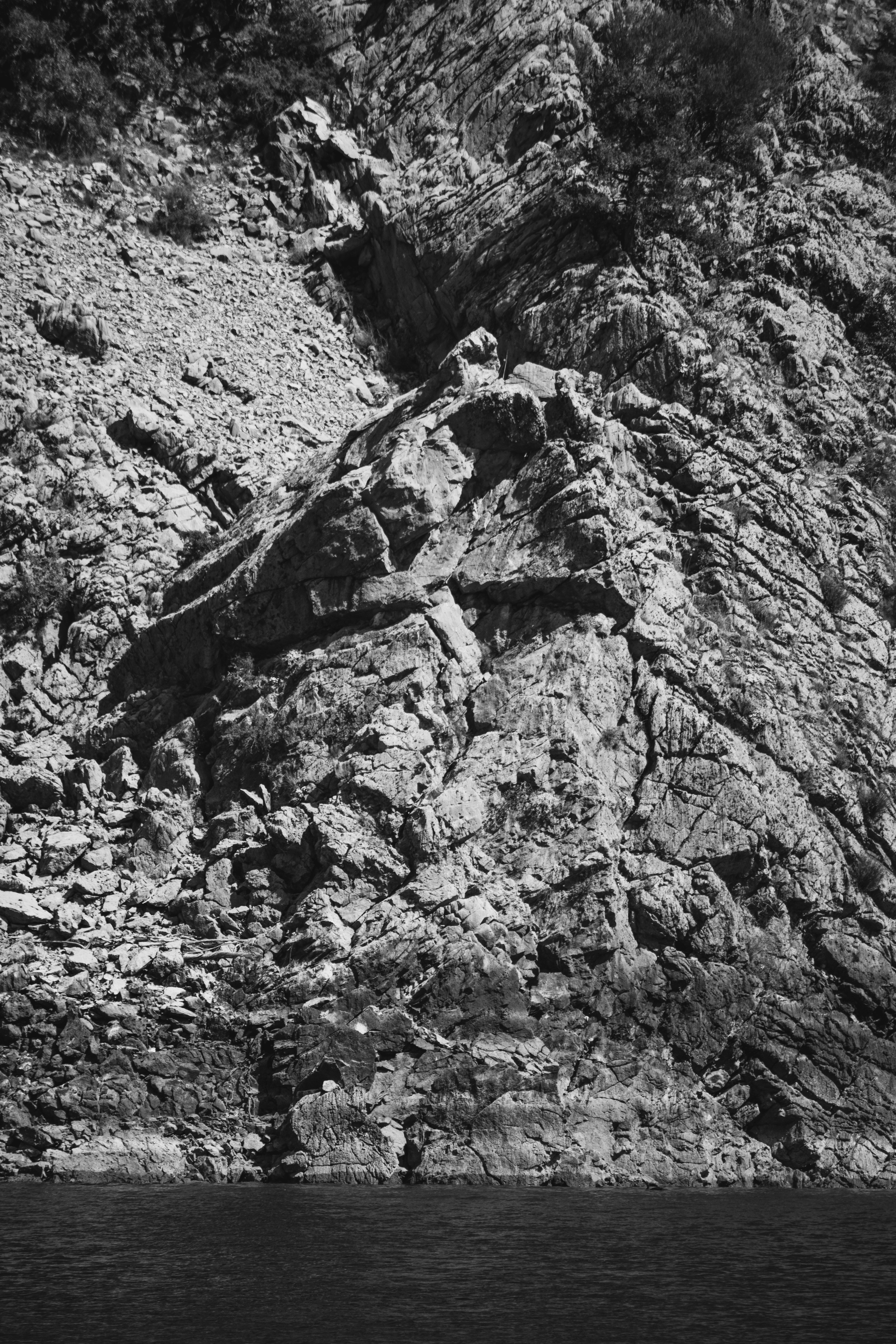 A black and white photo of a rocky cliff photo – Free Nature Image on ...