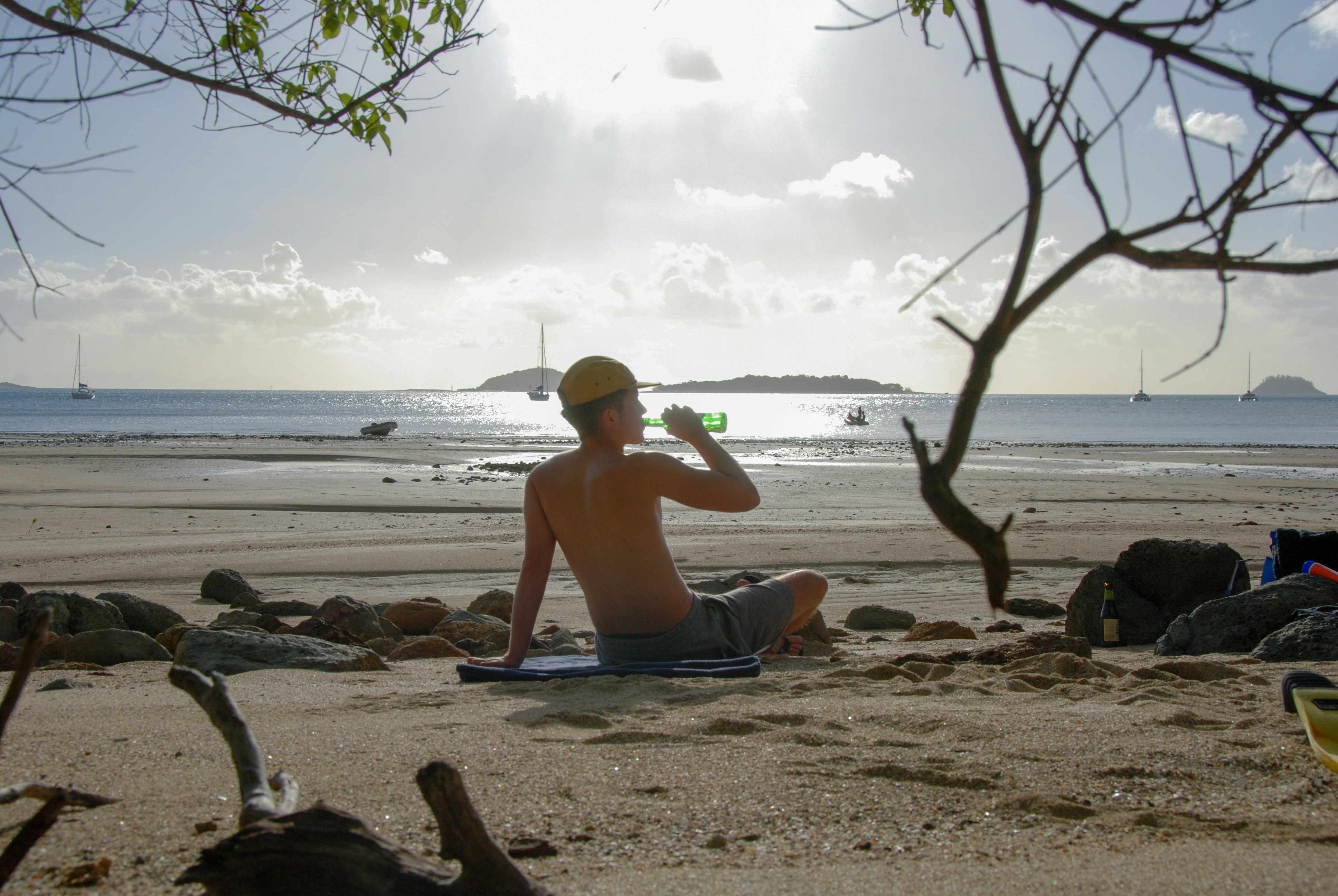 Sunlit Shoreline Portrait: A Quiet Beach Moment