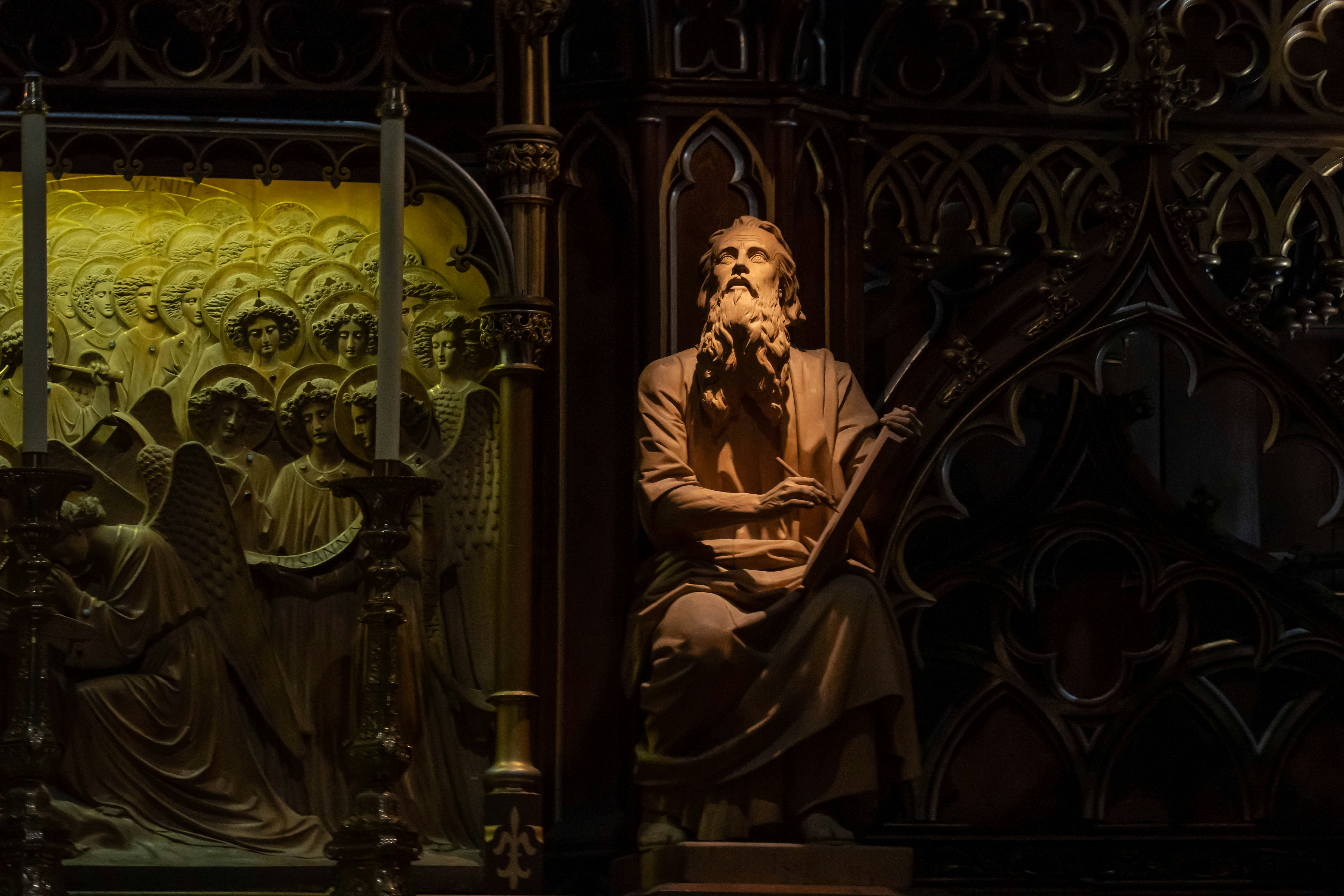 Gothic Quiet: The Seated Saint in Amber Light