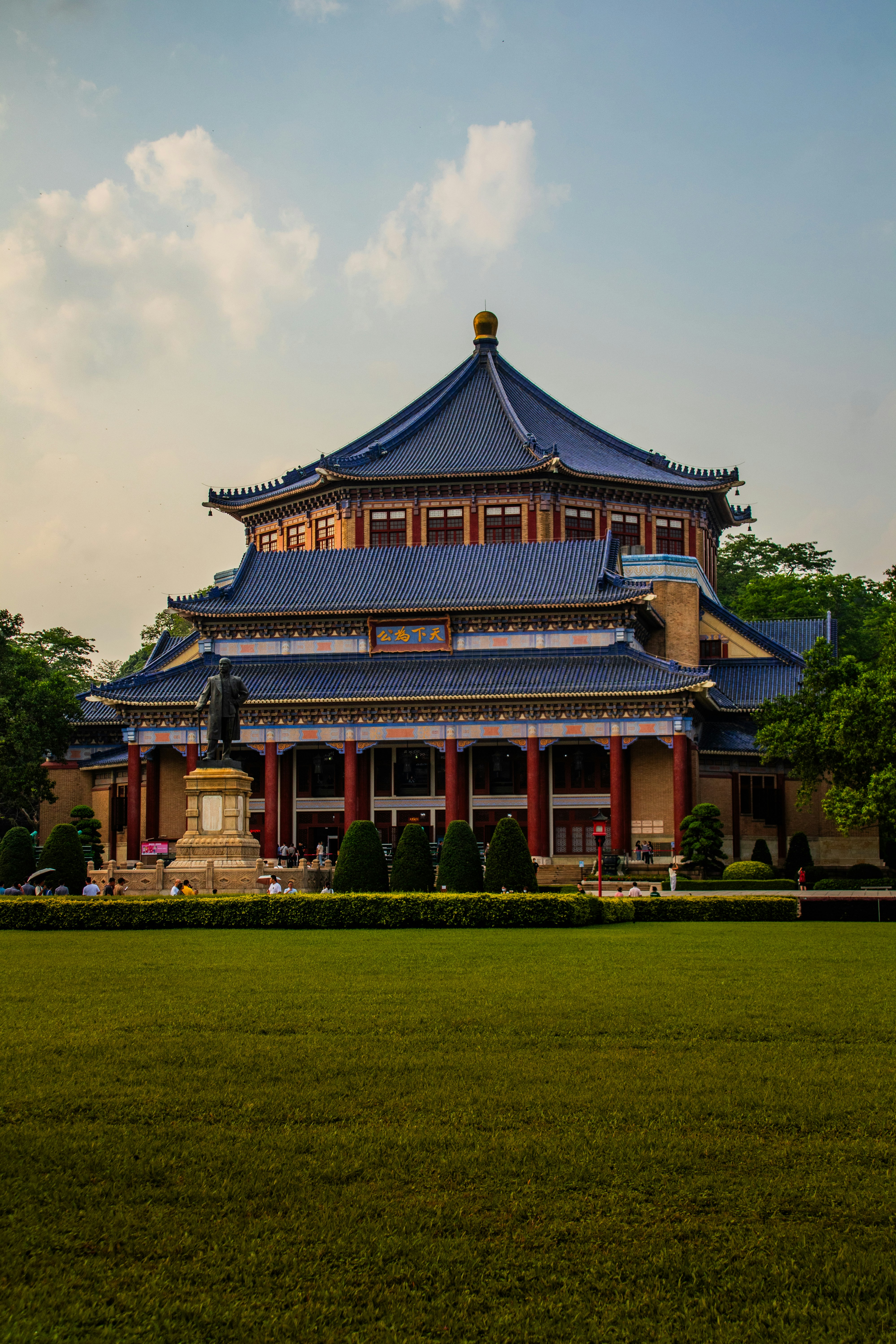 A large building with a blue roof in a park photo – Free Guangzhou ...
