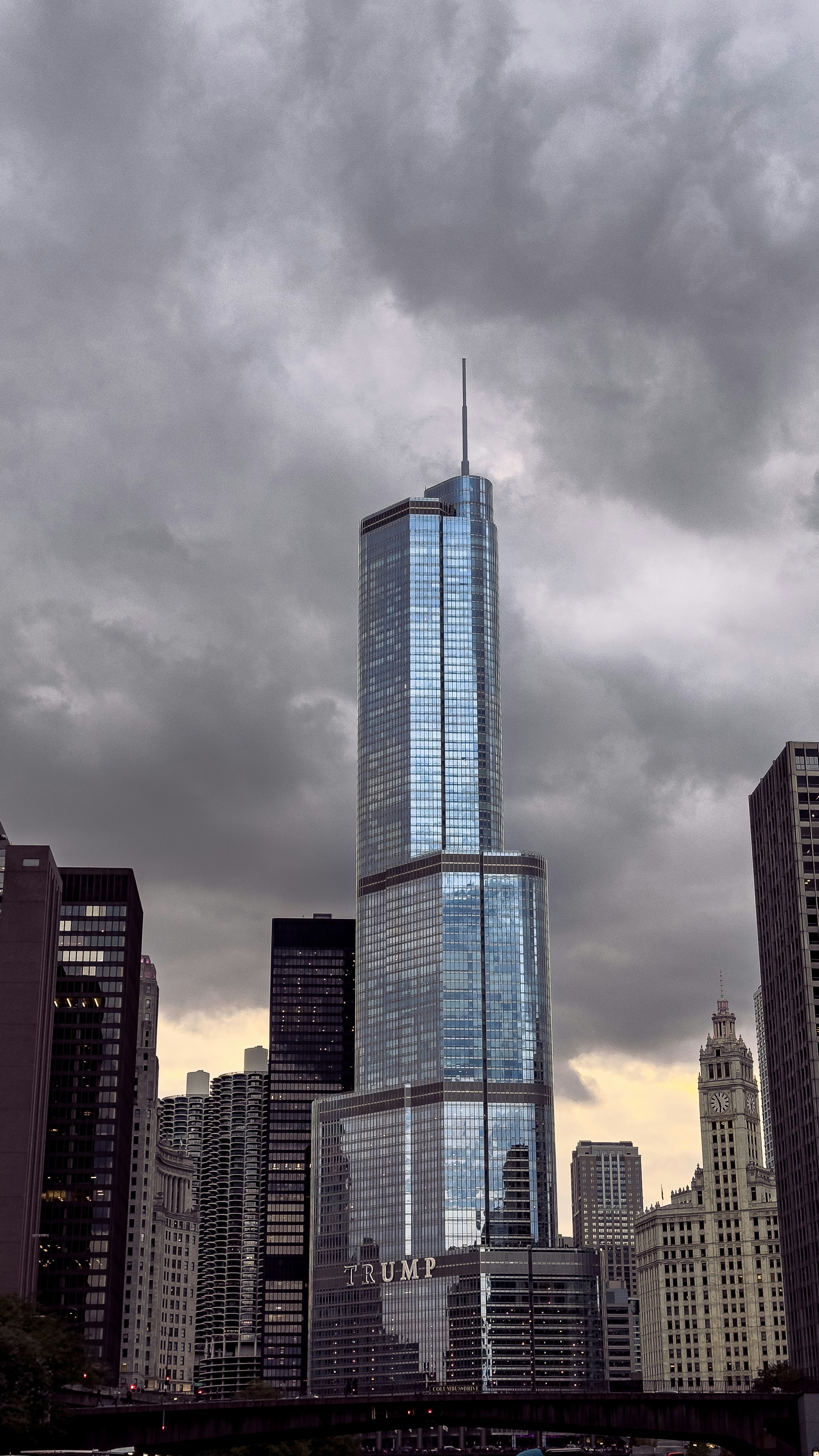 Glass Spire Rising Through Brooding Clouds: The Trump Tower Skyline