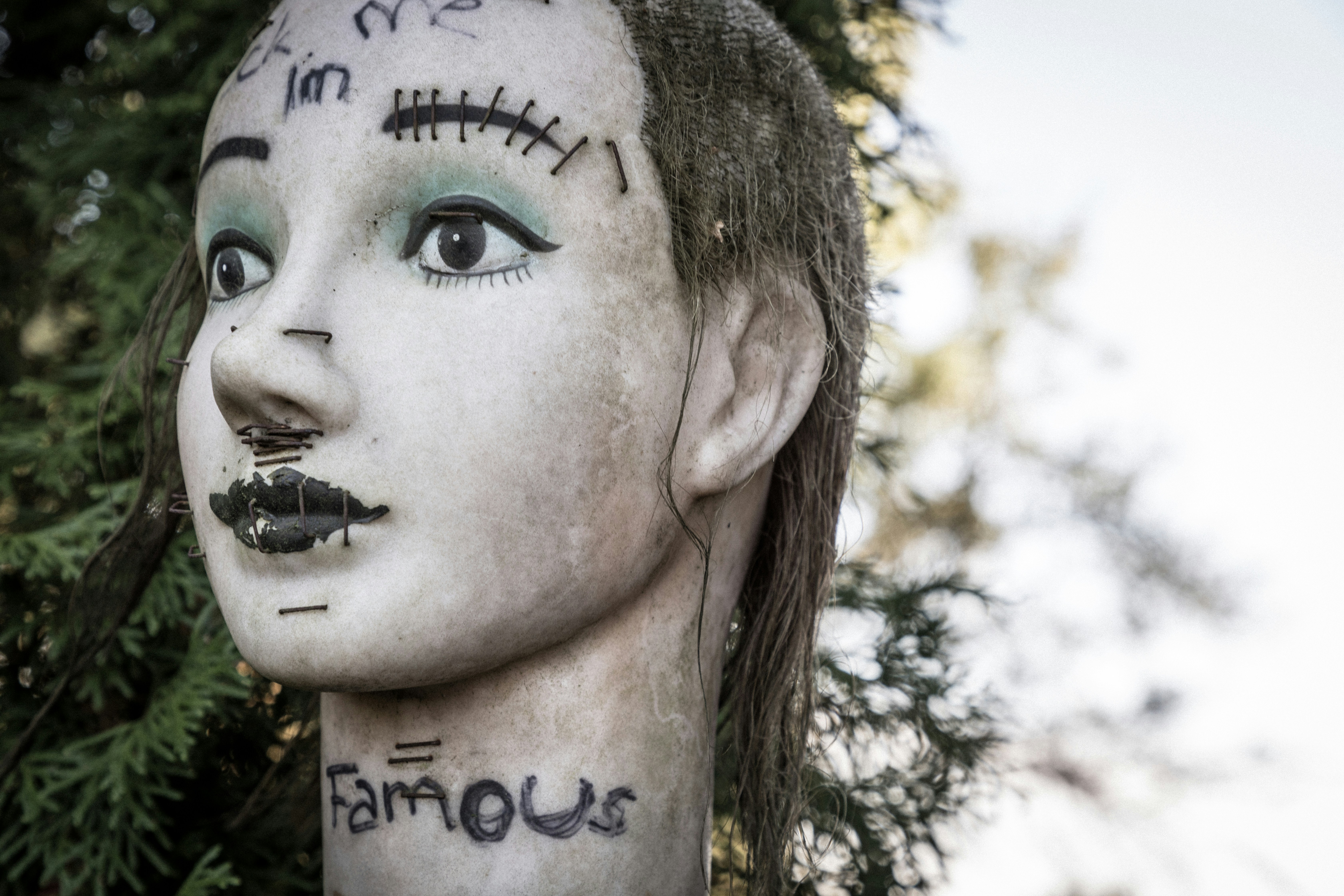 A statue of a woman with makeup on her face photo – Free Portrait Image ...